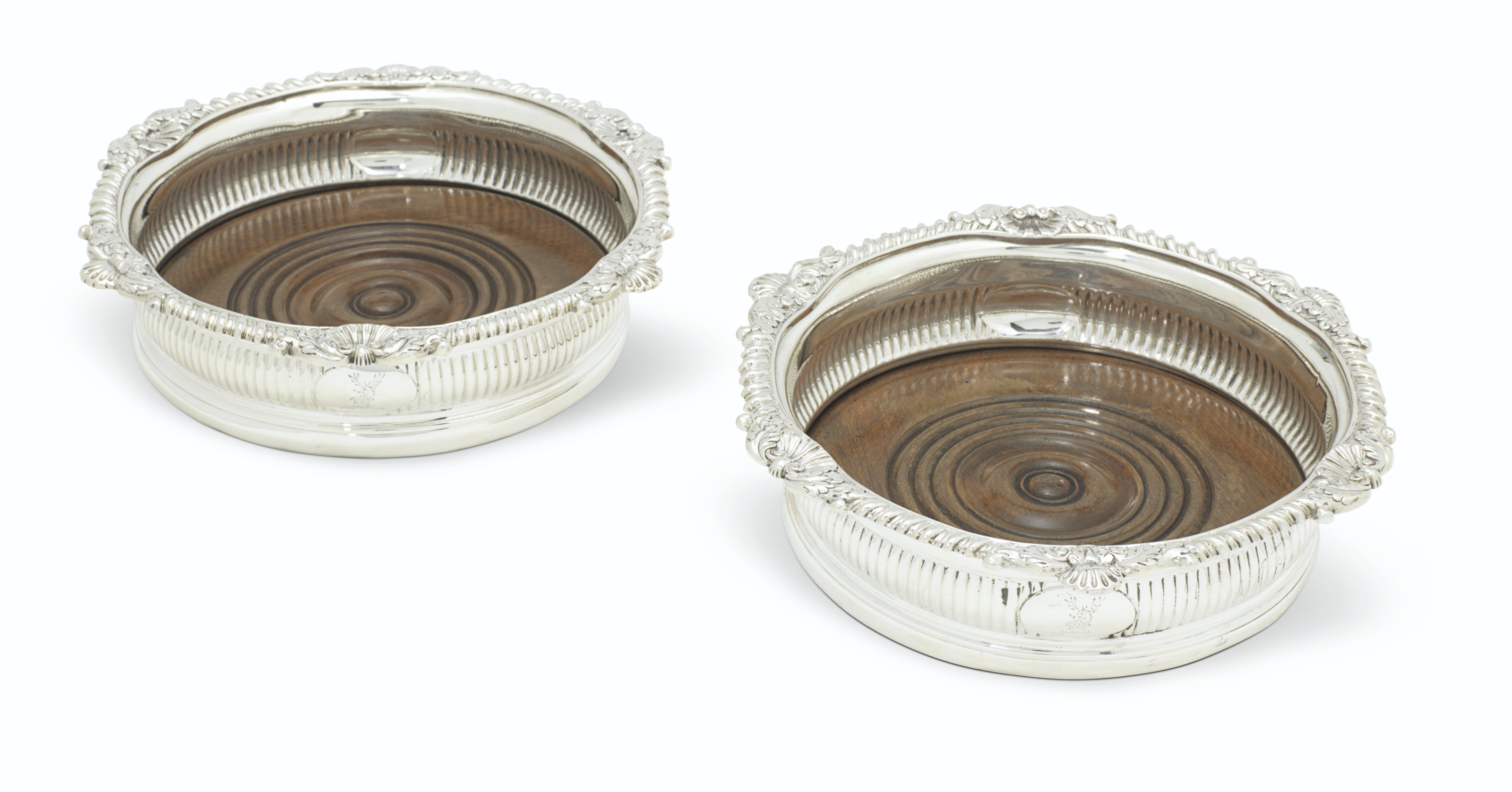 A PAIR OF GEORGE III SILVER WINE COASTERS, MARK OF SAMUEL HENNELL AND ...