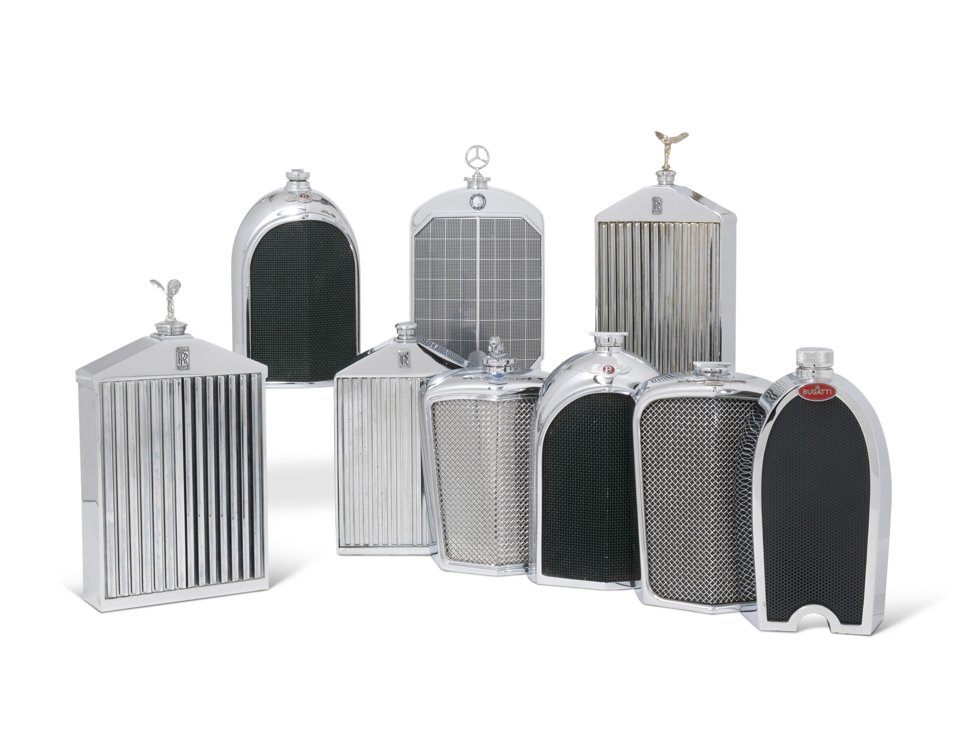 A GROUP OF NINE CHROMIUM-PLATED NOVELTY FLASKS, MOST BY RUDDSPEED ...