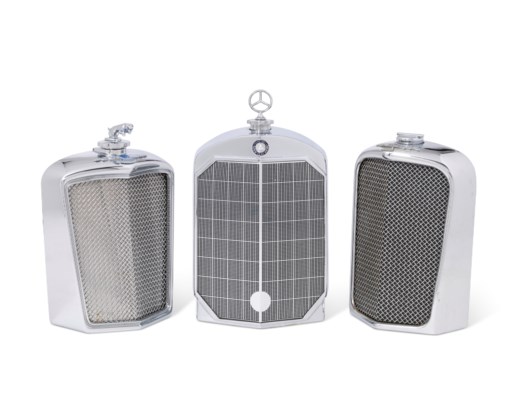 A GROUP OF NINE CHROMIUM-PLATED NOVELTY FLASKS, MOST BY RUDDSPEED ...