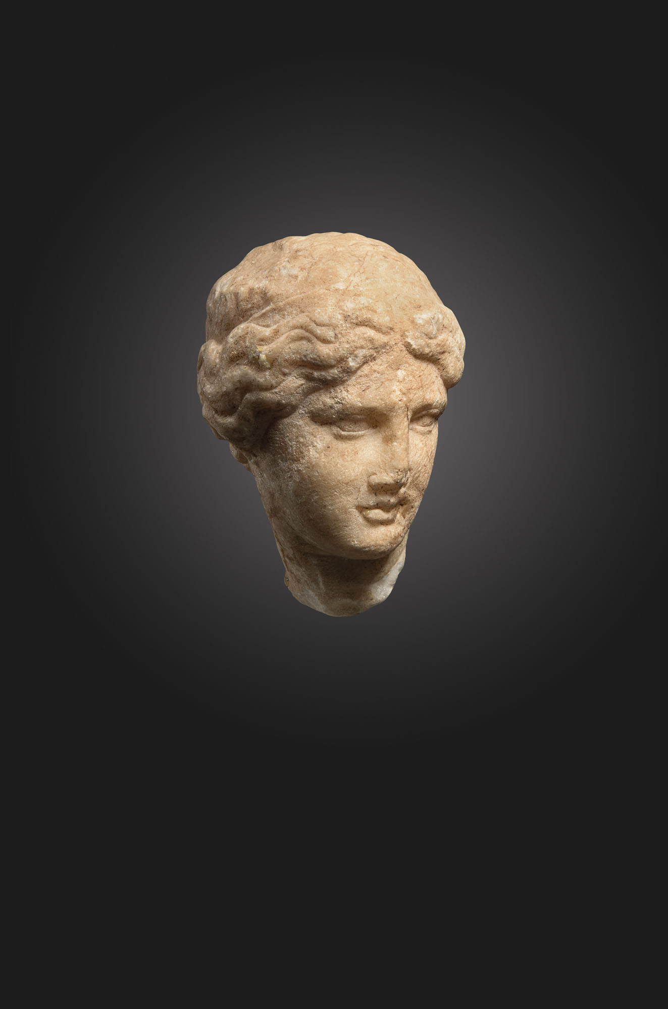 A GREEK MARBLE HEAD OF A GODDESS, CLASSICAL PERIOD, CIRCA 4TH CENTURY B ...