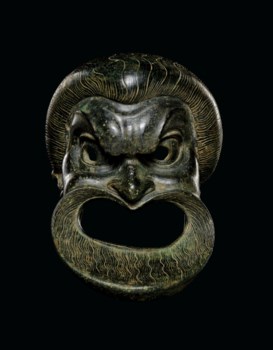 A ROMAN BRONZE MASK OF A COMIC ACTOR, CIRCA 1ST CENTURY A.D. | Christie's