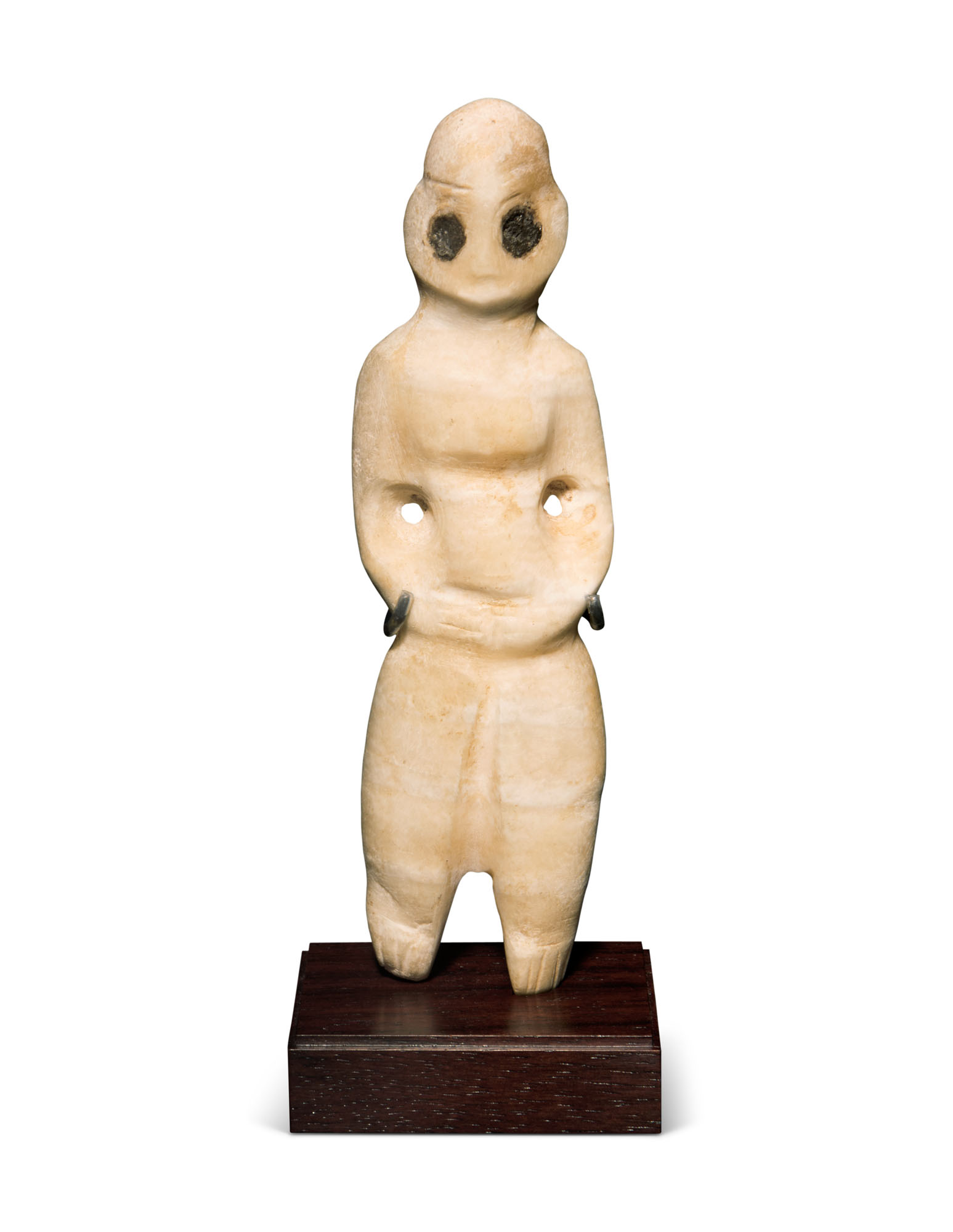 A MESOPOTAMIAN ALABASTER FEMALE IDOL, NEOLITHIC PERIOD, CIRCA 5500 B.C ...