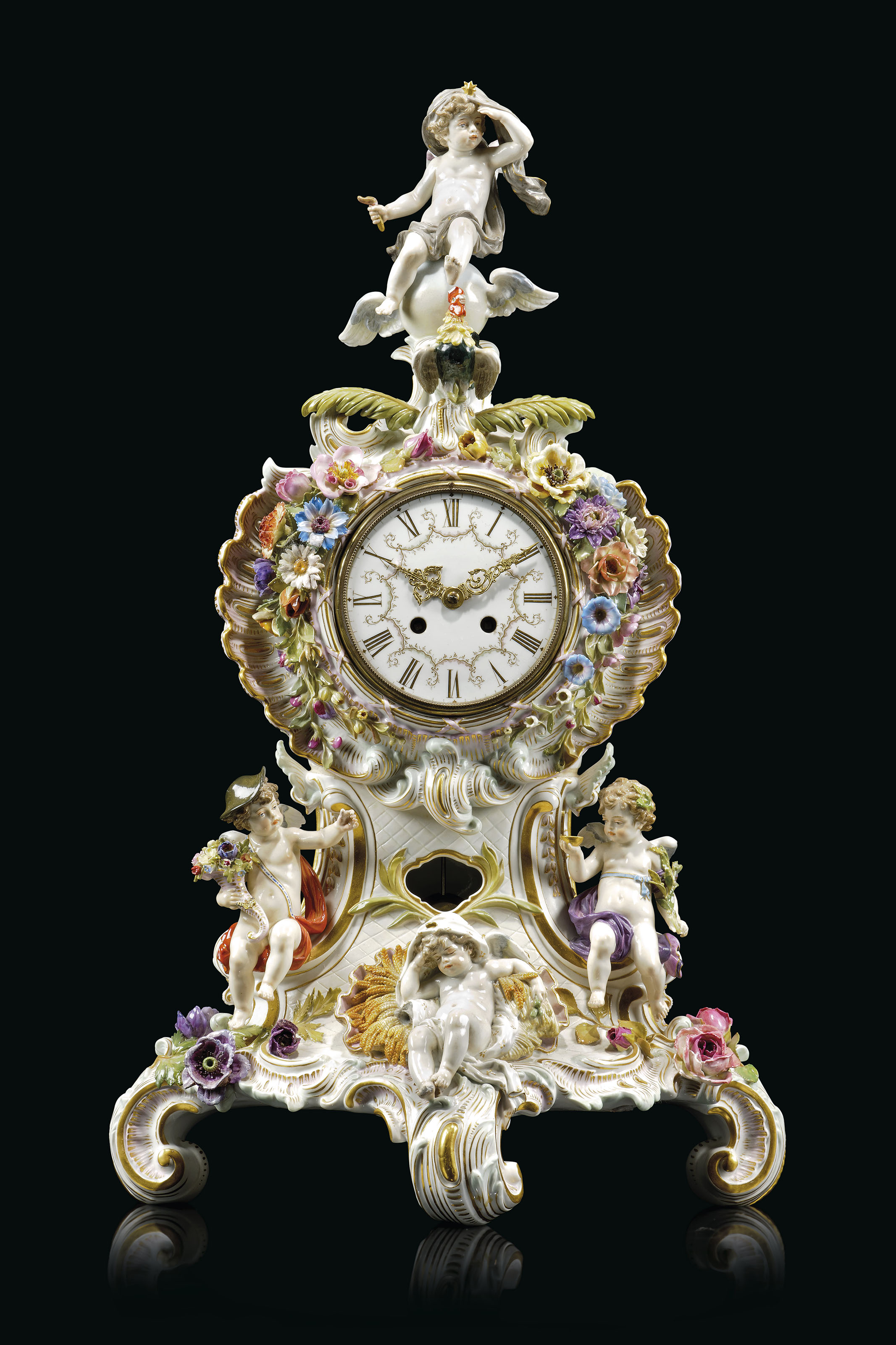 A MEISSEN FLOWER-ENCRUSTED MANTLE CLOCK, CIRCA 1880, BLUE CROSSED ...