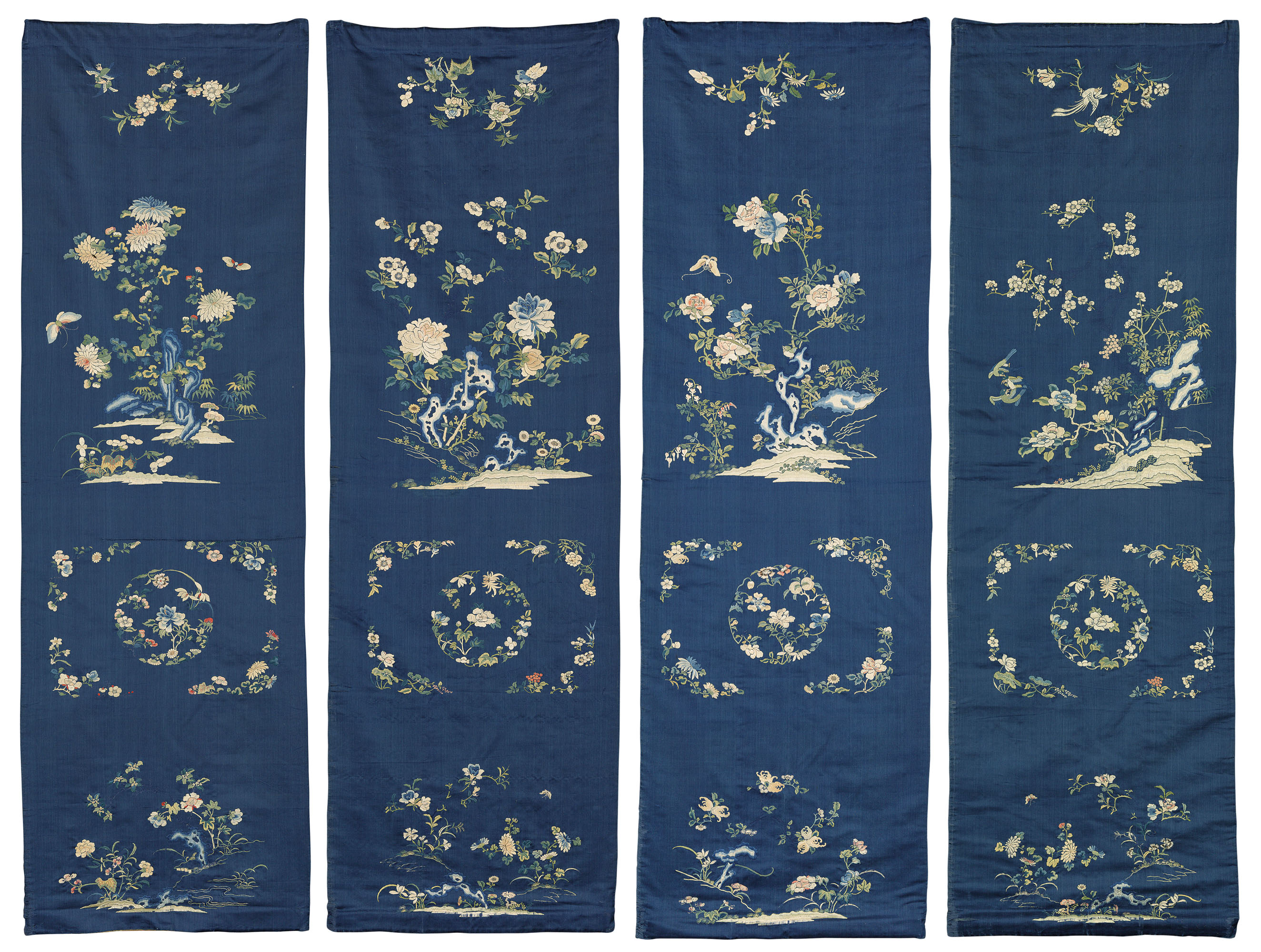 A SET OF FOUR BLUE-GROUND SILK EMBROIDERED CHAIR COVERS, 19TH CENTURY ...