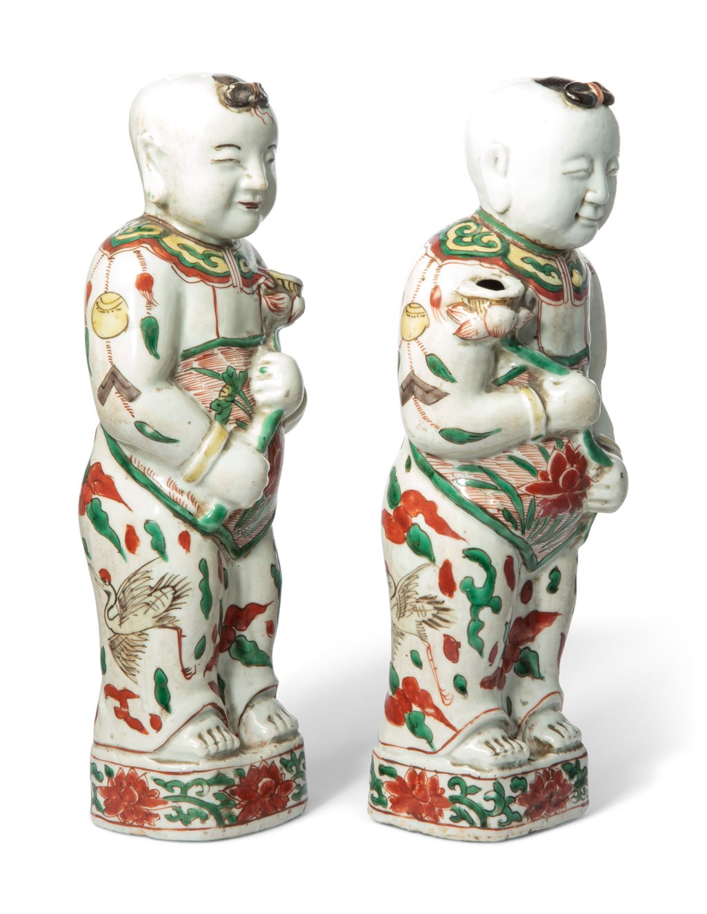 A PAIR OF CHINESE WUCAI FIGURES OF BOYS WITH LOTUS STEMS, 18TH CENTURY ...