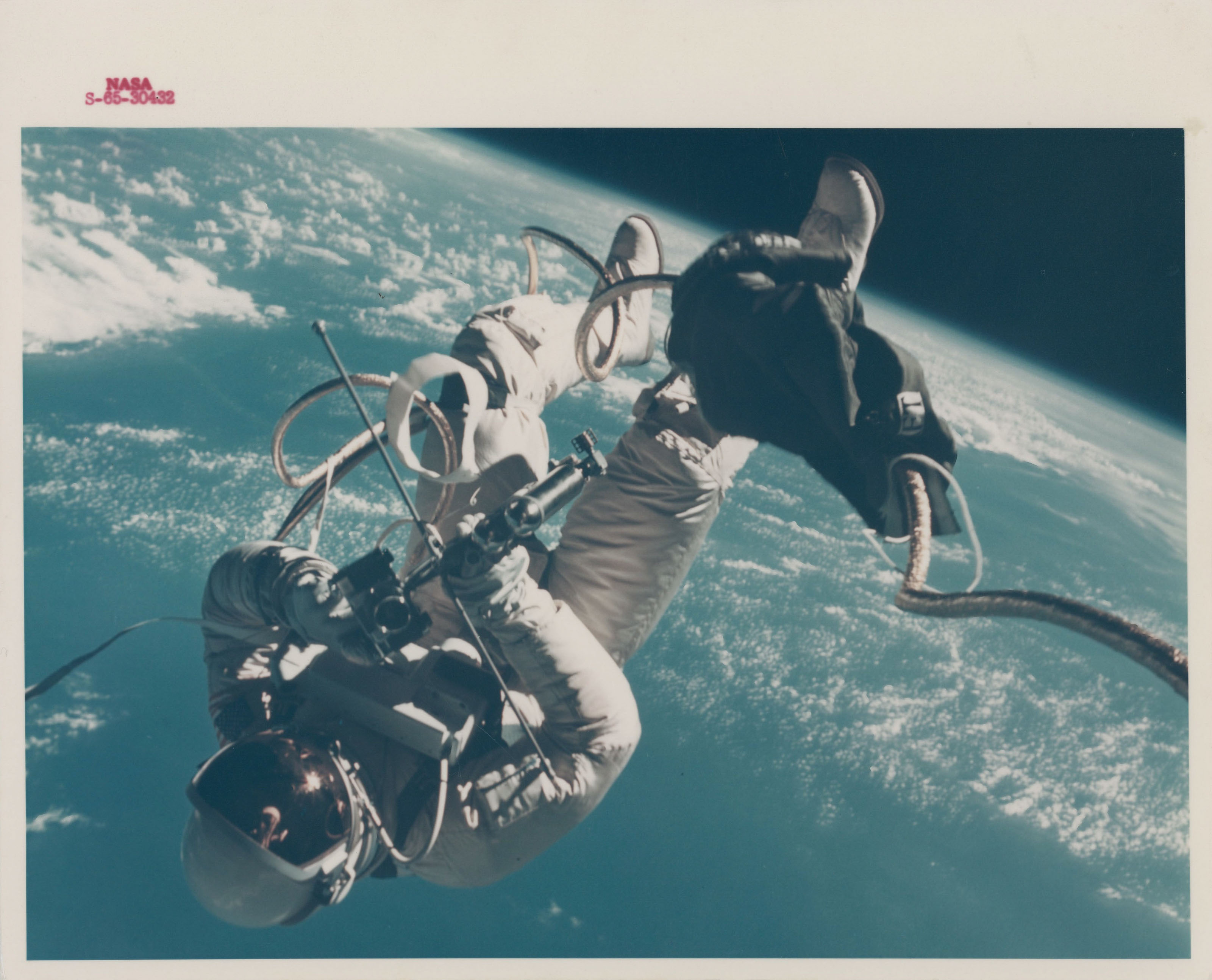 First US spacewalk: Ed White photographing the spacecraft during his ...