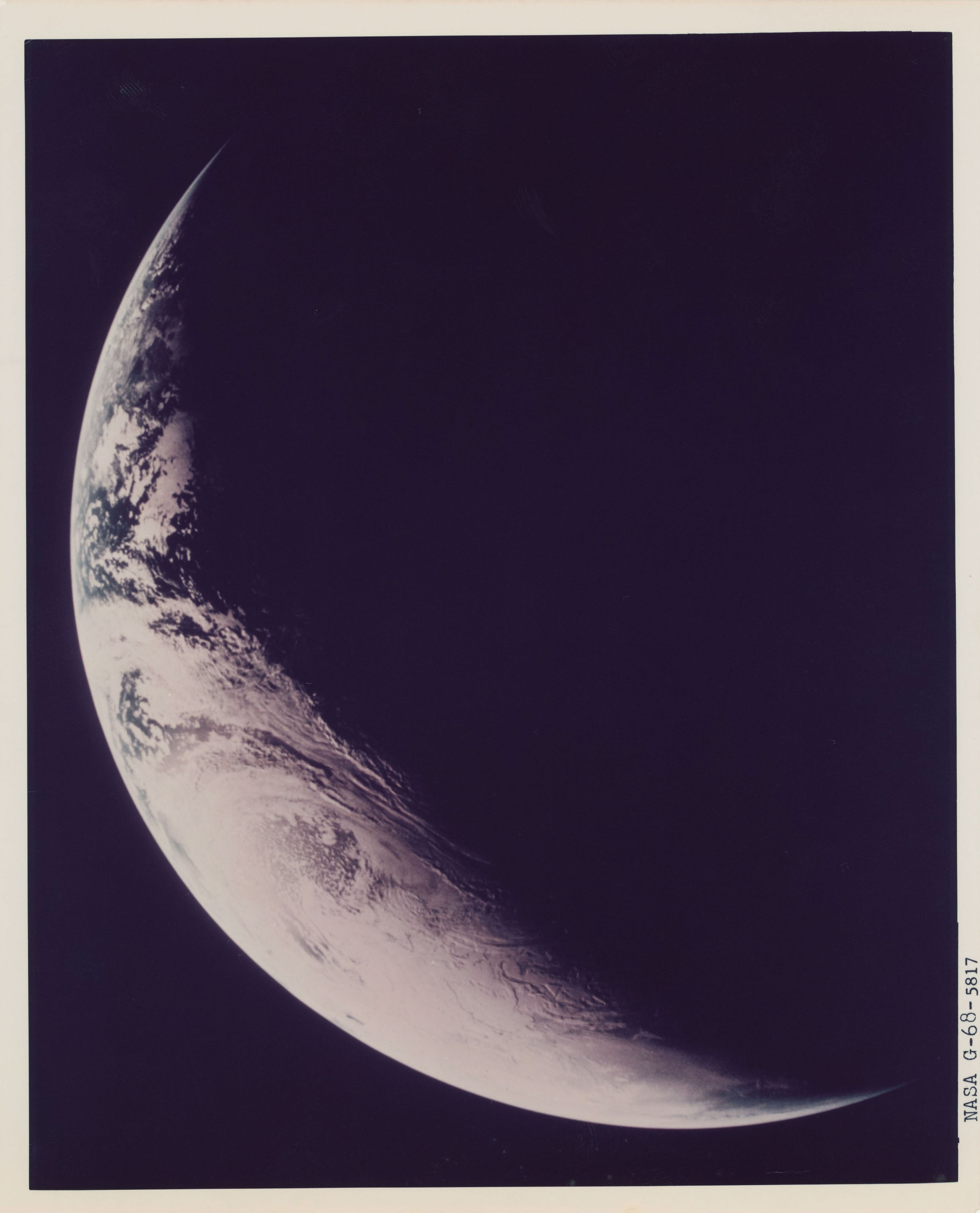 Full crescent Earth from high apogee; splashdown of the unmanned ...