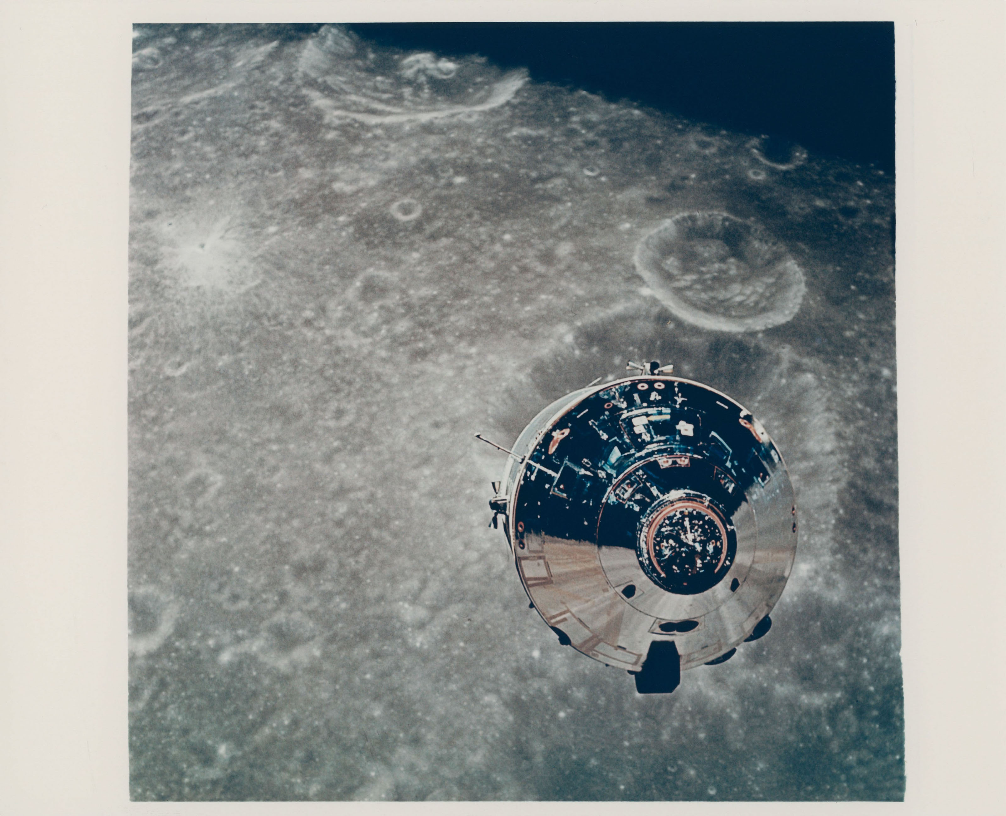 Views of the CM Charlie Brown in lunar orbit; moonscapes seen from ...