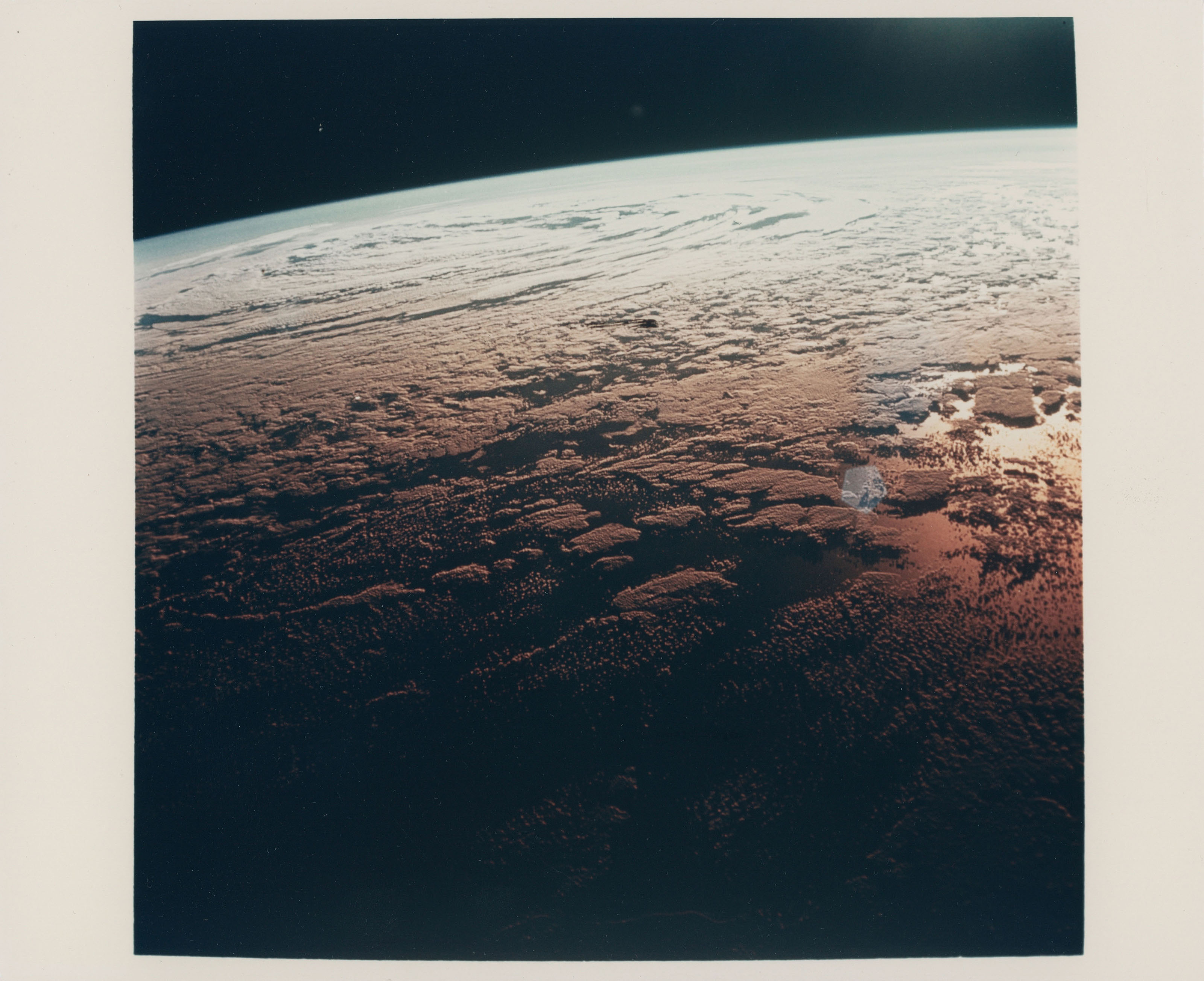 Sunrise on Earth before translunar injection; Earth after translunar ...