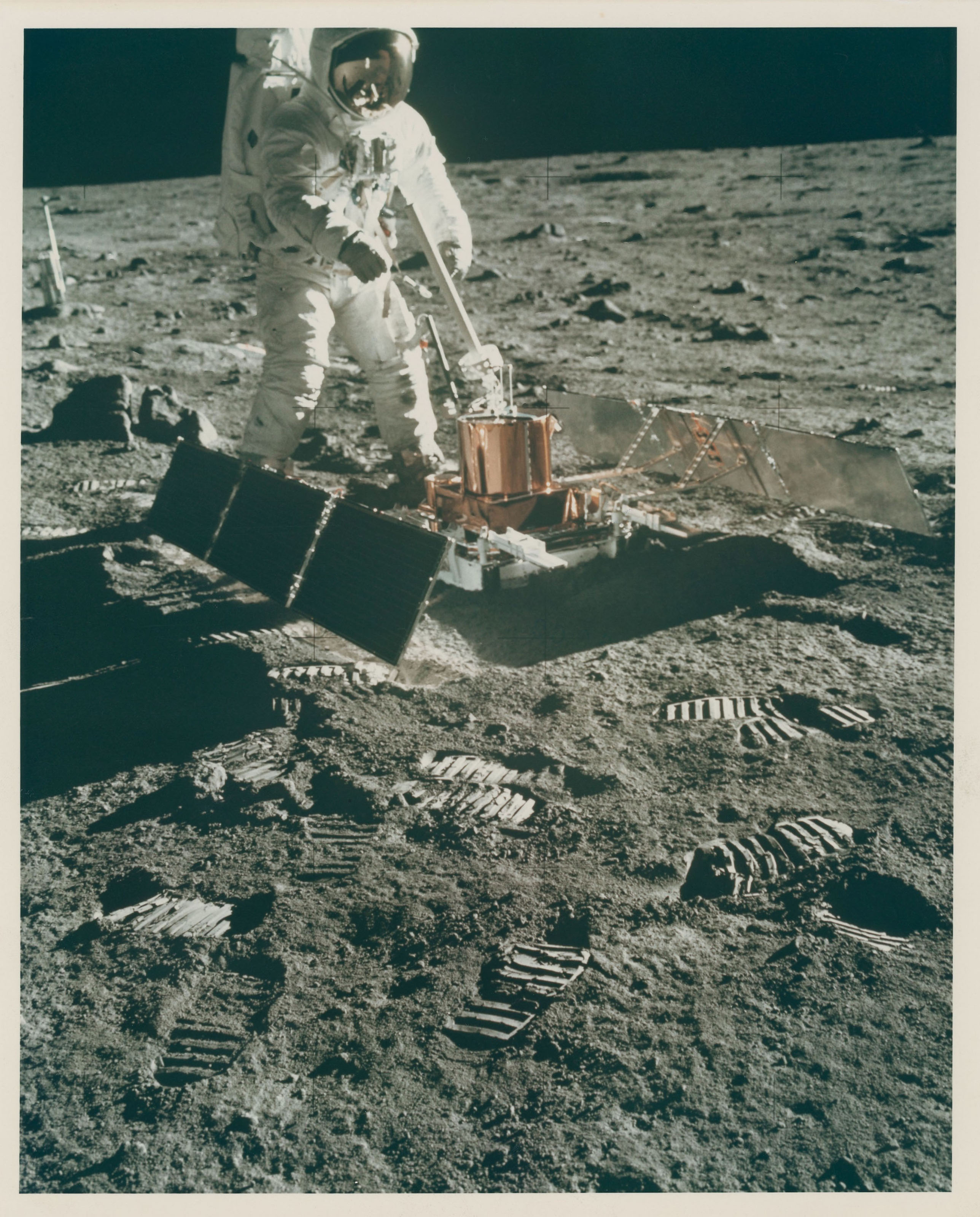 Close-up of Buzz Aldrin; Aldrin working at the lunar-science station ...