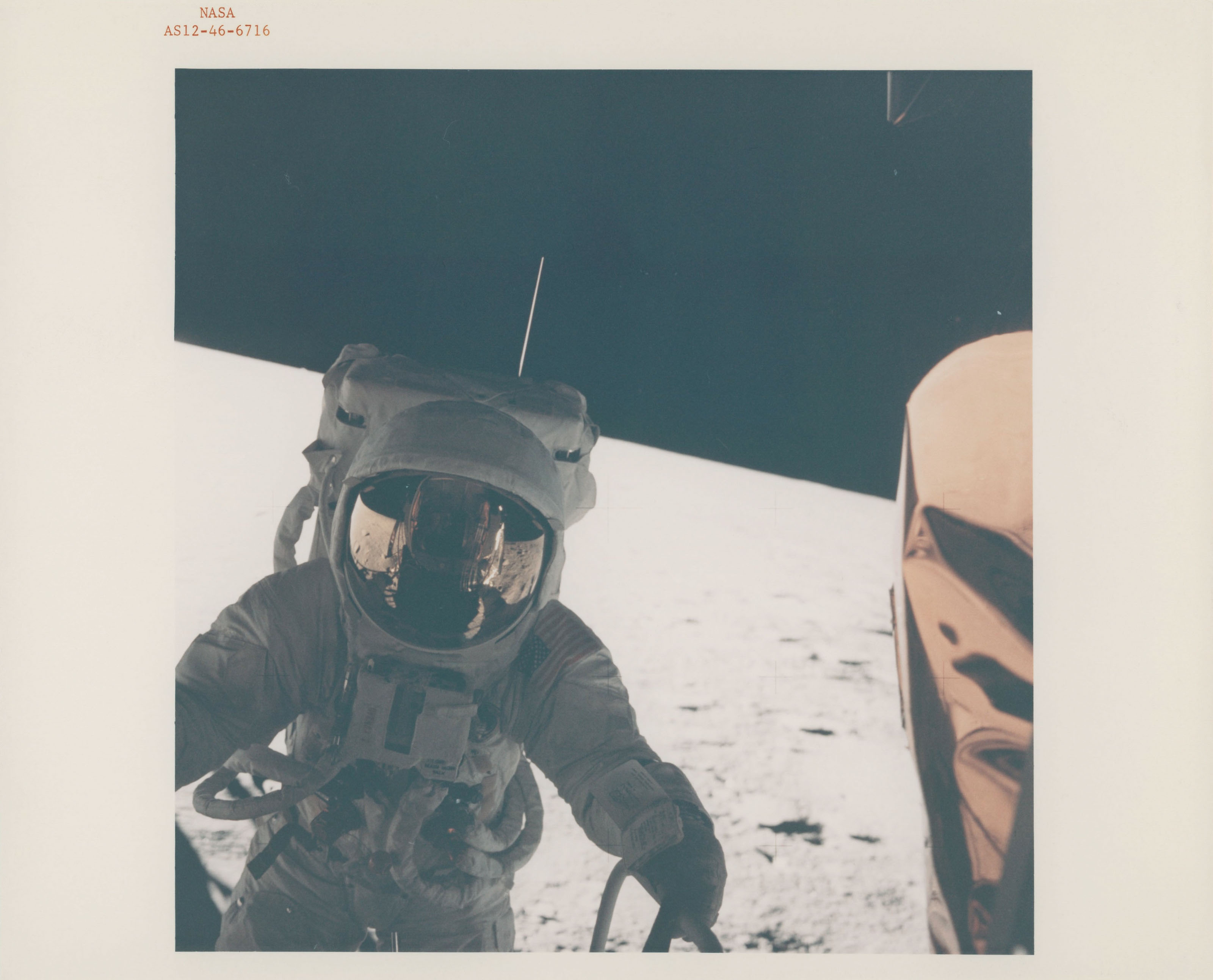 Pete Conrad descending the LM ladder to walk on the Moon; panoramic ...