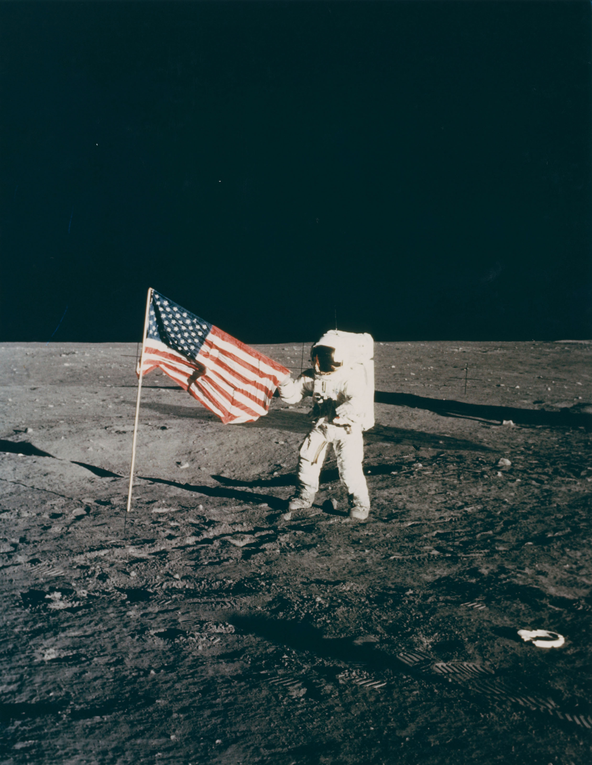 [Large Format] Pete Conrad holding the US flag on the Ocean of Storms ...