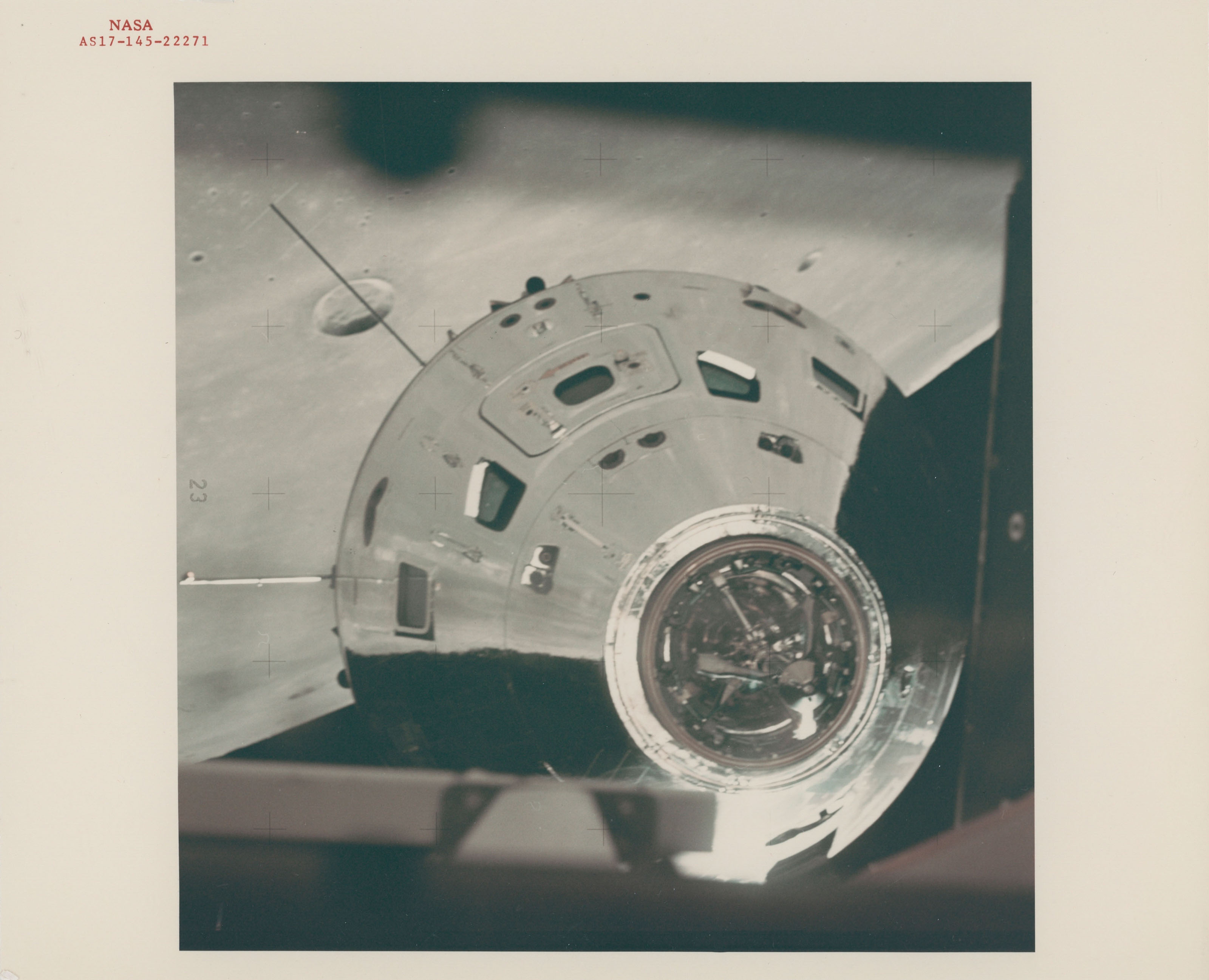 The CM America with all five windows facing the Moon; the LM Challenger ...