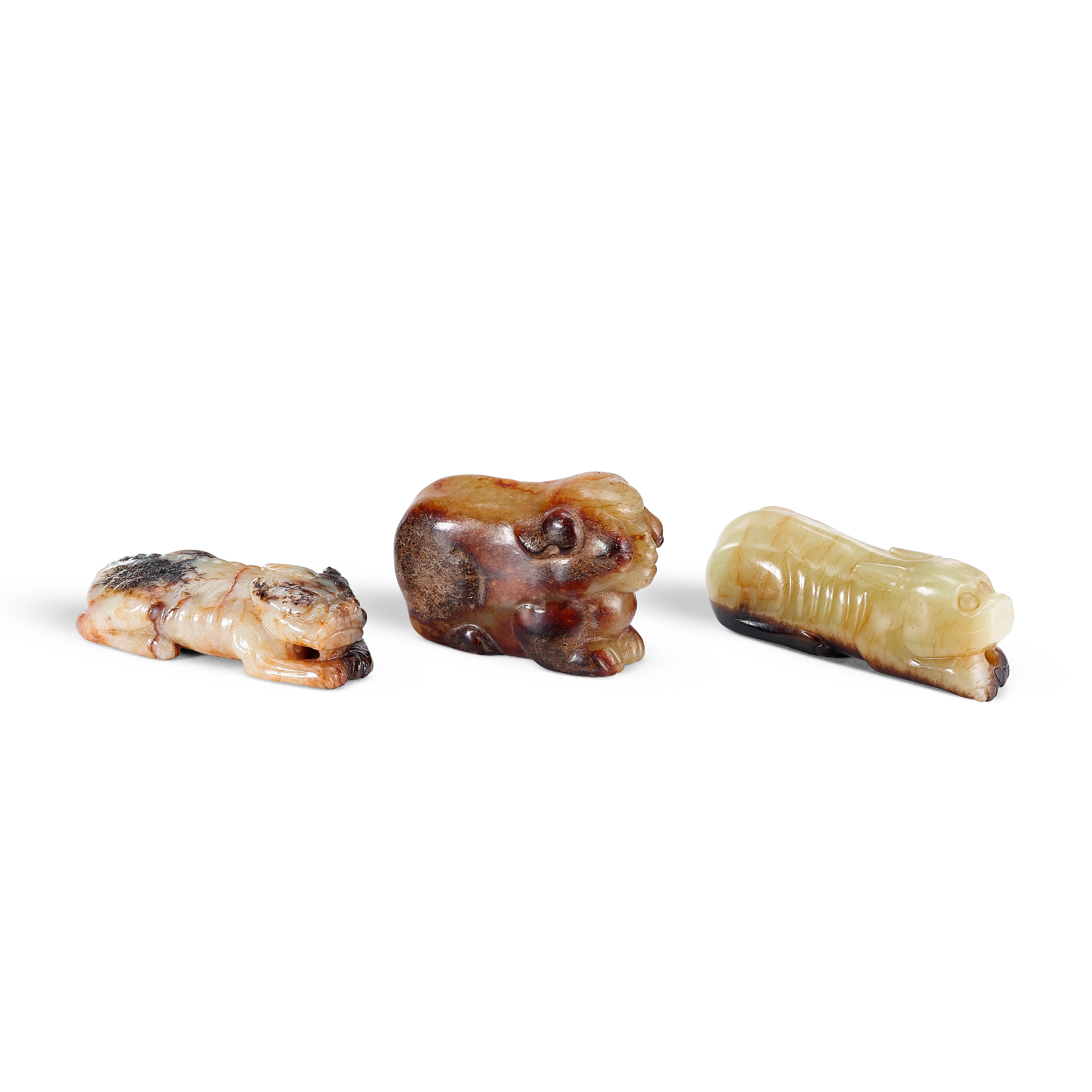A GROUP OF THREE MOTTLED JADE ‘ANIMAL’ CARVINGS, MING DYNASTY (1368 ...