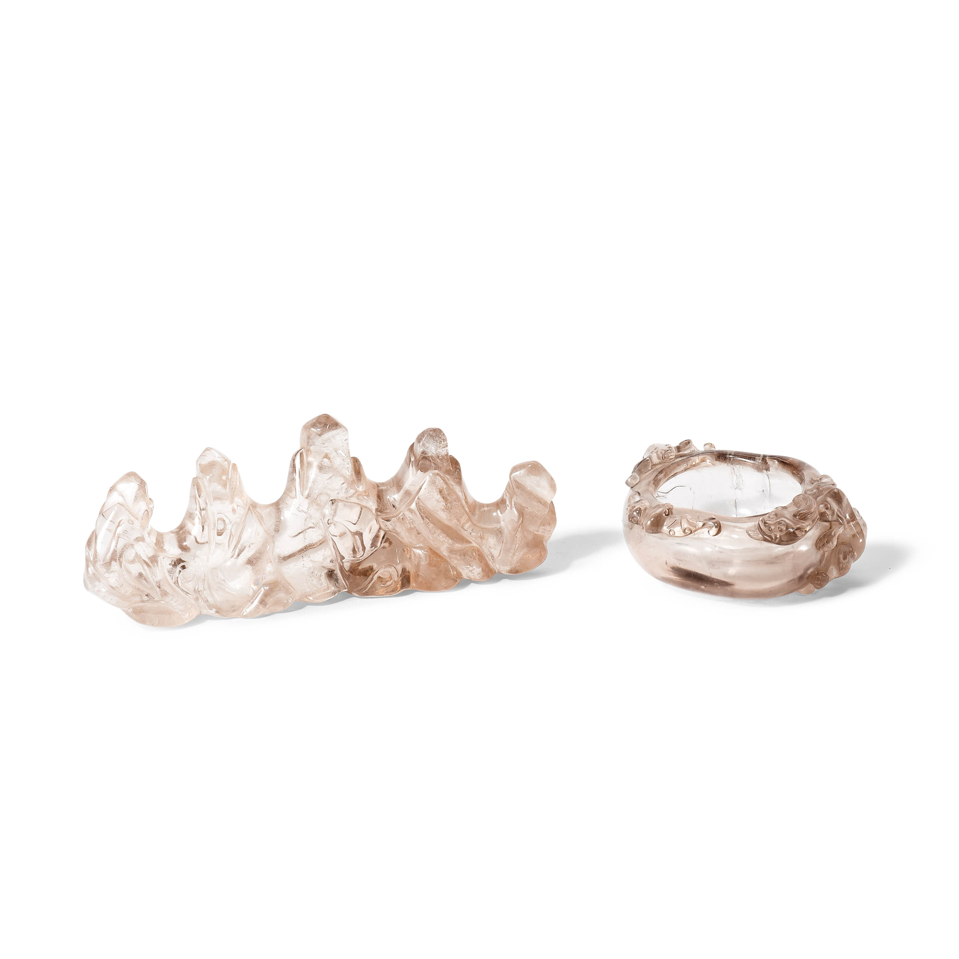 A CARVED ROCK CRYSTAL MOUNTAIN-FORM BRUSH REST AND A CARVED ROCK ...