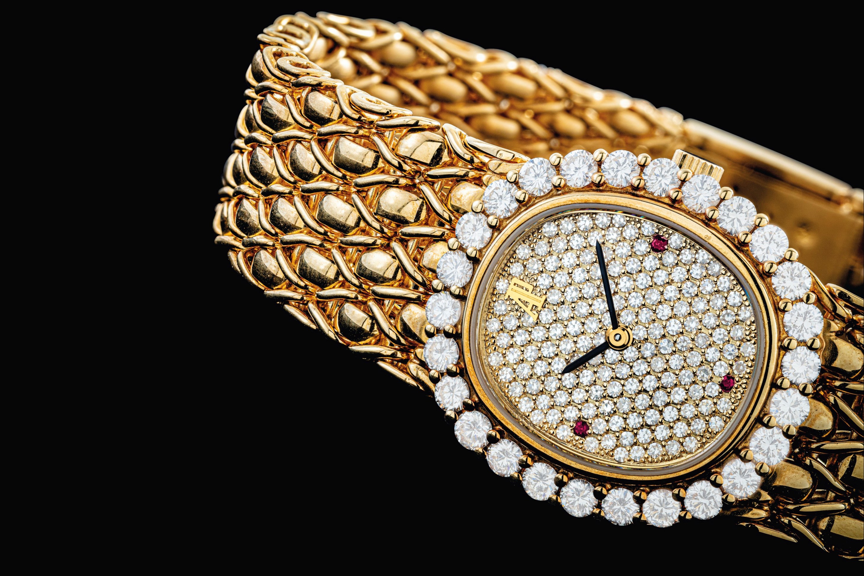 AUDEMARS PIGUET. A LADY'S RARE AND ELEGANT 18K GOLD, DIAMOND AND RUBY ...