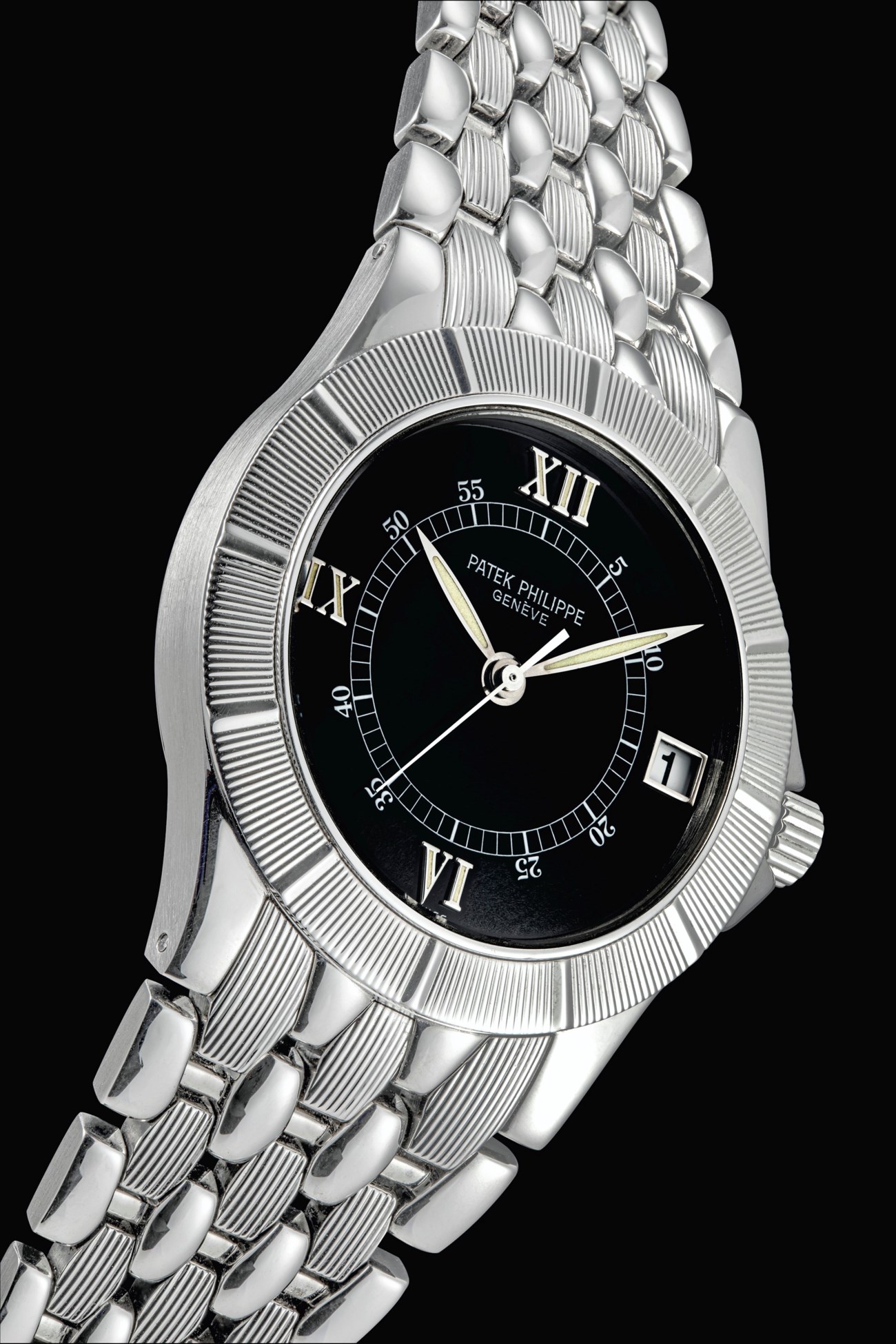 PATEK PHILIPPE. A STAINLESS STEEL AUTOMATIC WRISTWATCH WITH DATE AND ...