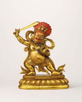 A GILT-BRONZE FIGURE OF DHARMAPALA AND A STAND