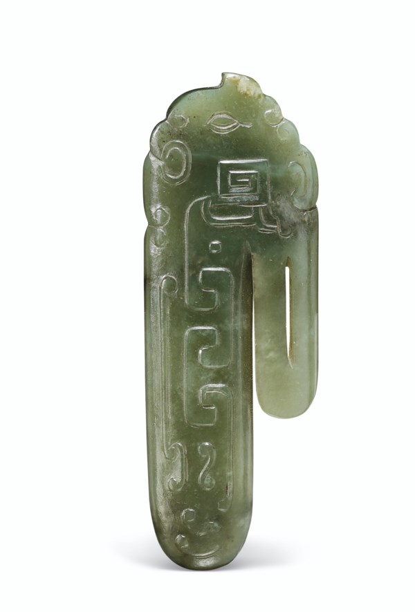 AN IMPERIAL SPINACH-GREEN JADE SCROLL CLIP, QIANLONG YUYONG FOUR ...