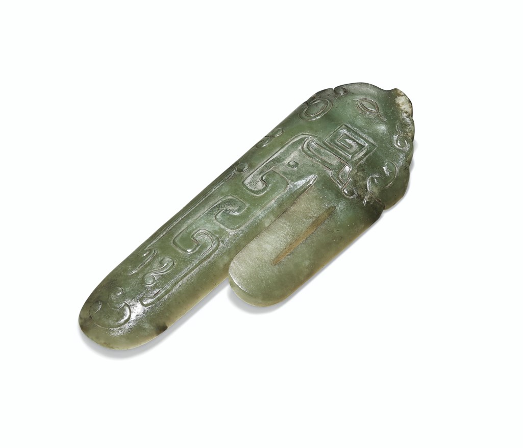 AN IMPERIAL SPINACH-GREEN JADE SCROLL CLIP, QIANLONG YUYONG FOUR ...