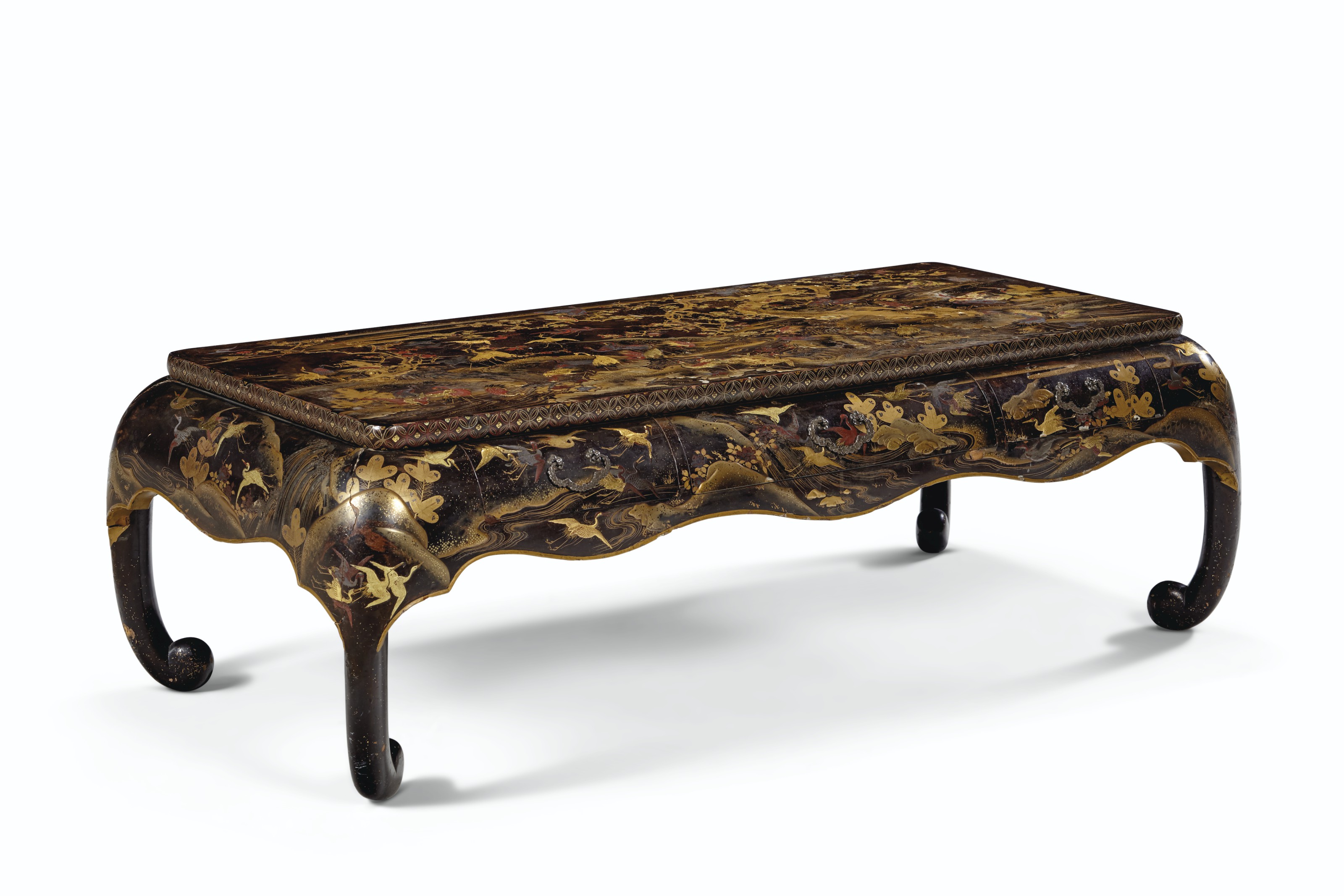 A JAPANESE EXPORT BROWN, GILT AND POLYCHROME LACQUER LOW TABLE, LATE ...
