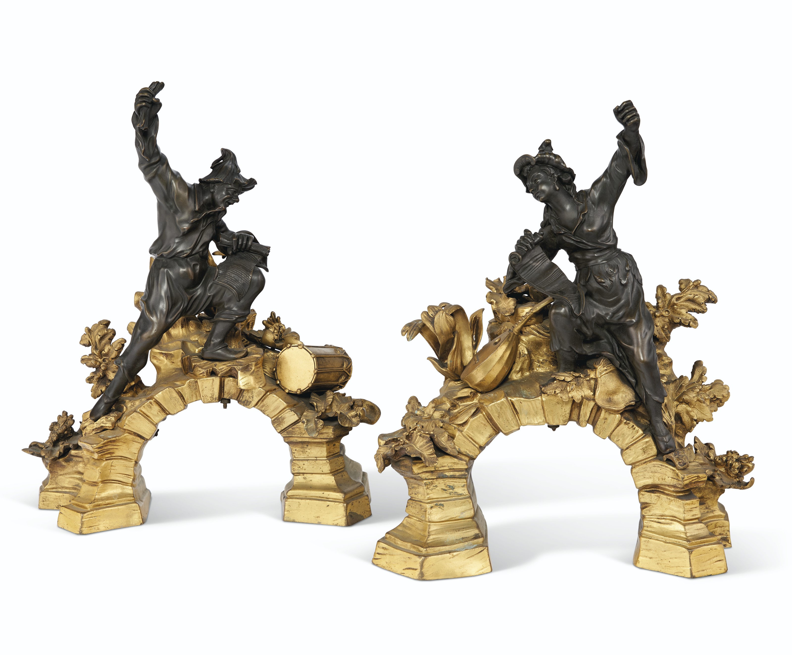 A PAIR OF FRENCH ORMOLU AND PATINATED BRONZE CHENETS, AFTER A MODEL BY ...