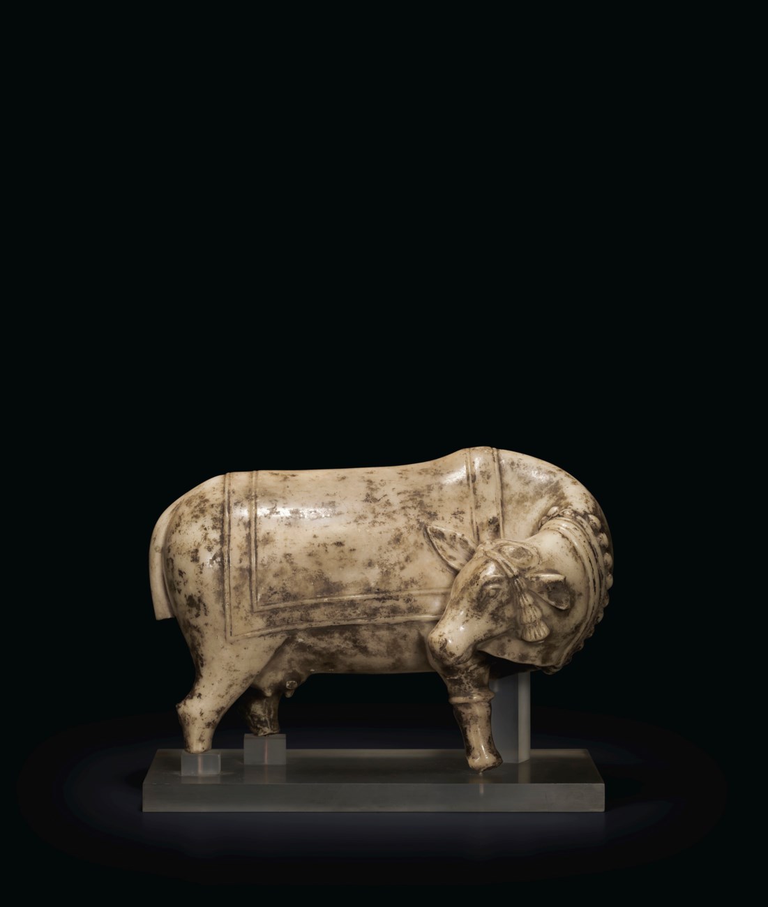 A MARBLE FIGURE OF A BULL, INDIA, RAJASTHAN OR GUJARAT, 16TH CENTURY OR ...