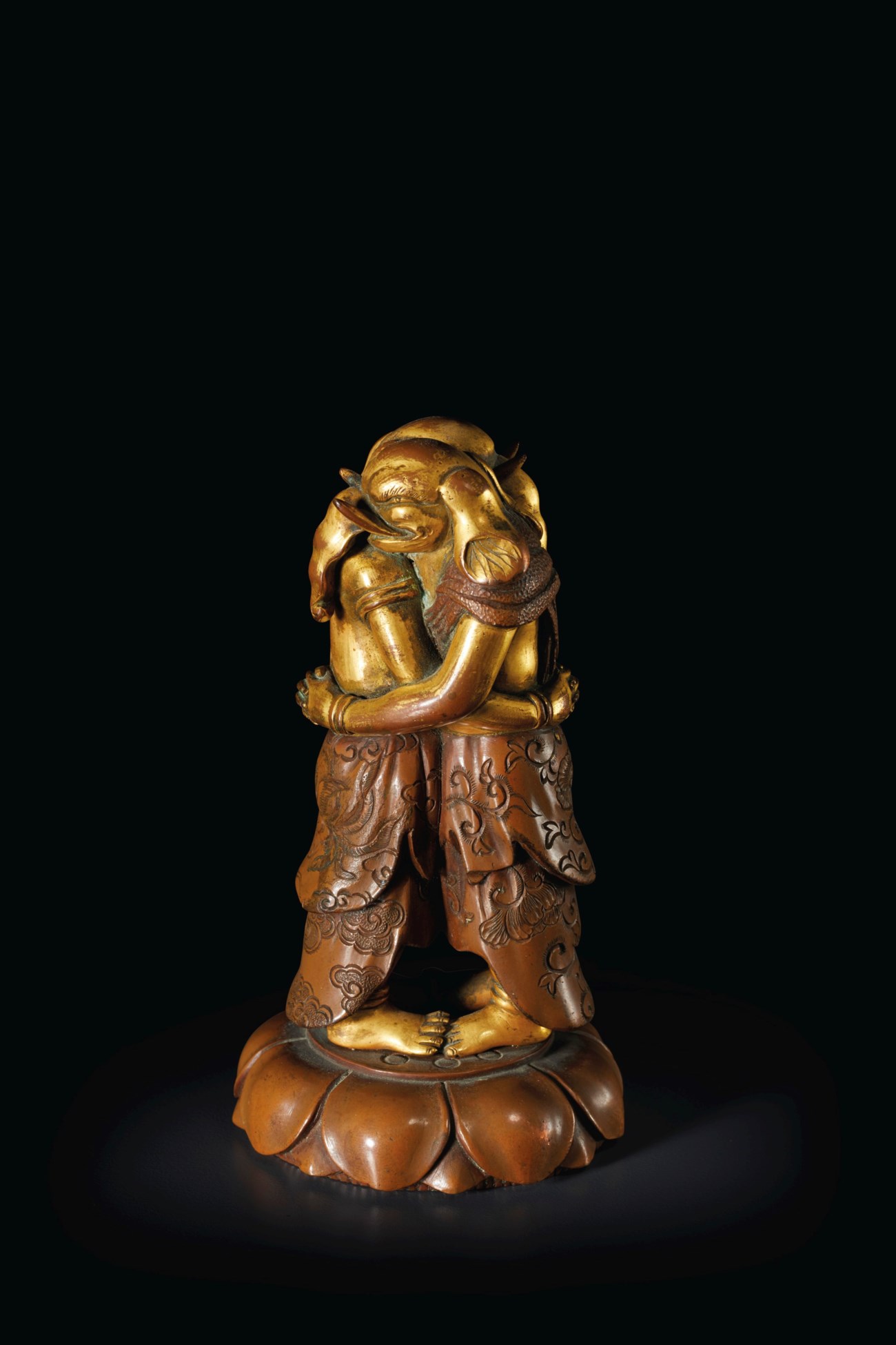 A BRONZE AND GILT-BRONZE SCULPTURE OF KANKITEN (GANAPATI)