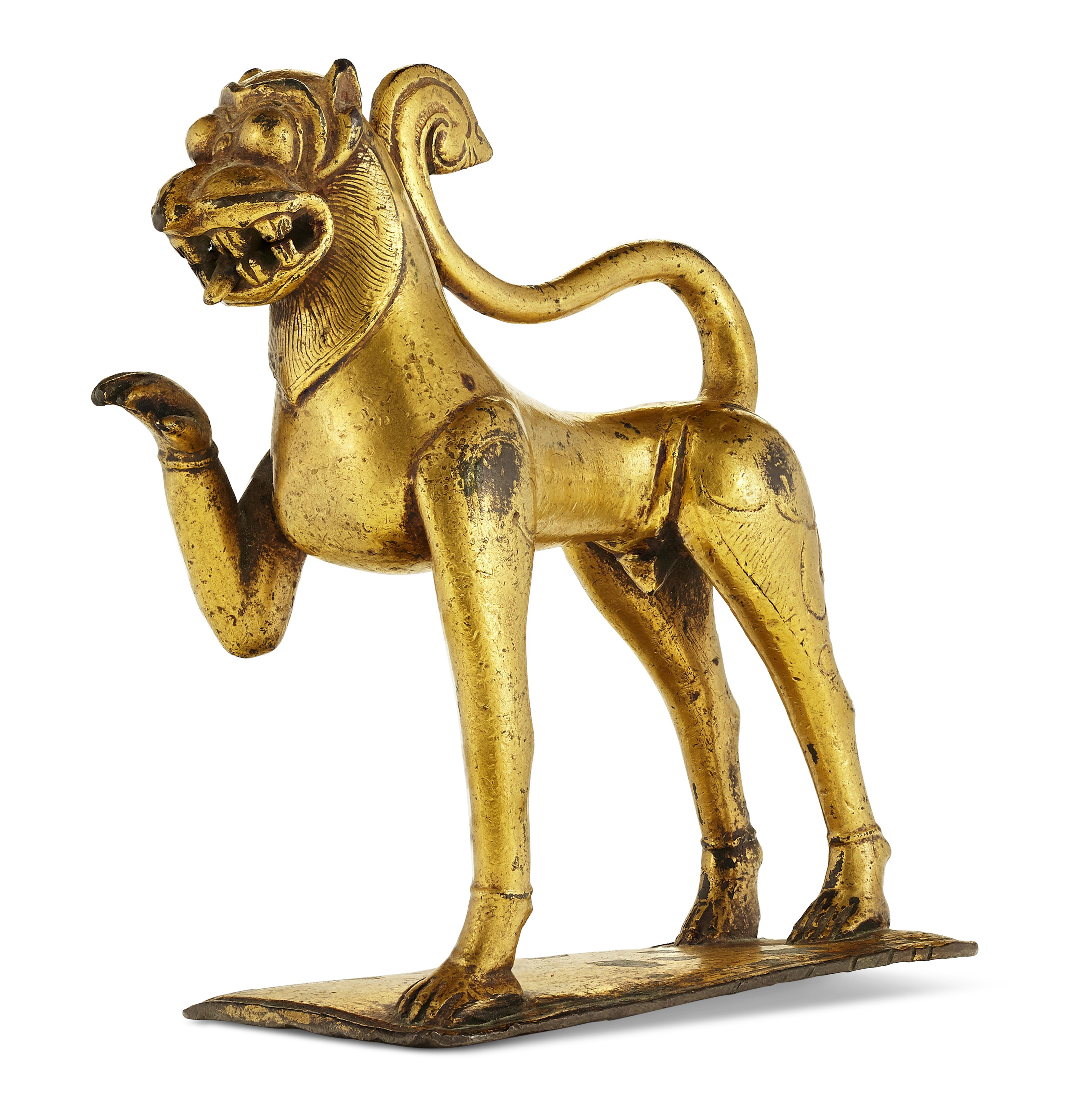 A GILT-BRONZE FIGURE OF A LION, SRI LANKA, KANDYAN PERIOD, 18TH CENTURY ...