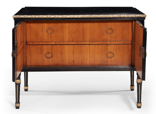 A NORTHERN EUROPEAN EBONIZED AND PARCEL-GILT DOUBLE DOOR COMMODE ...