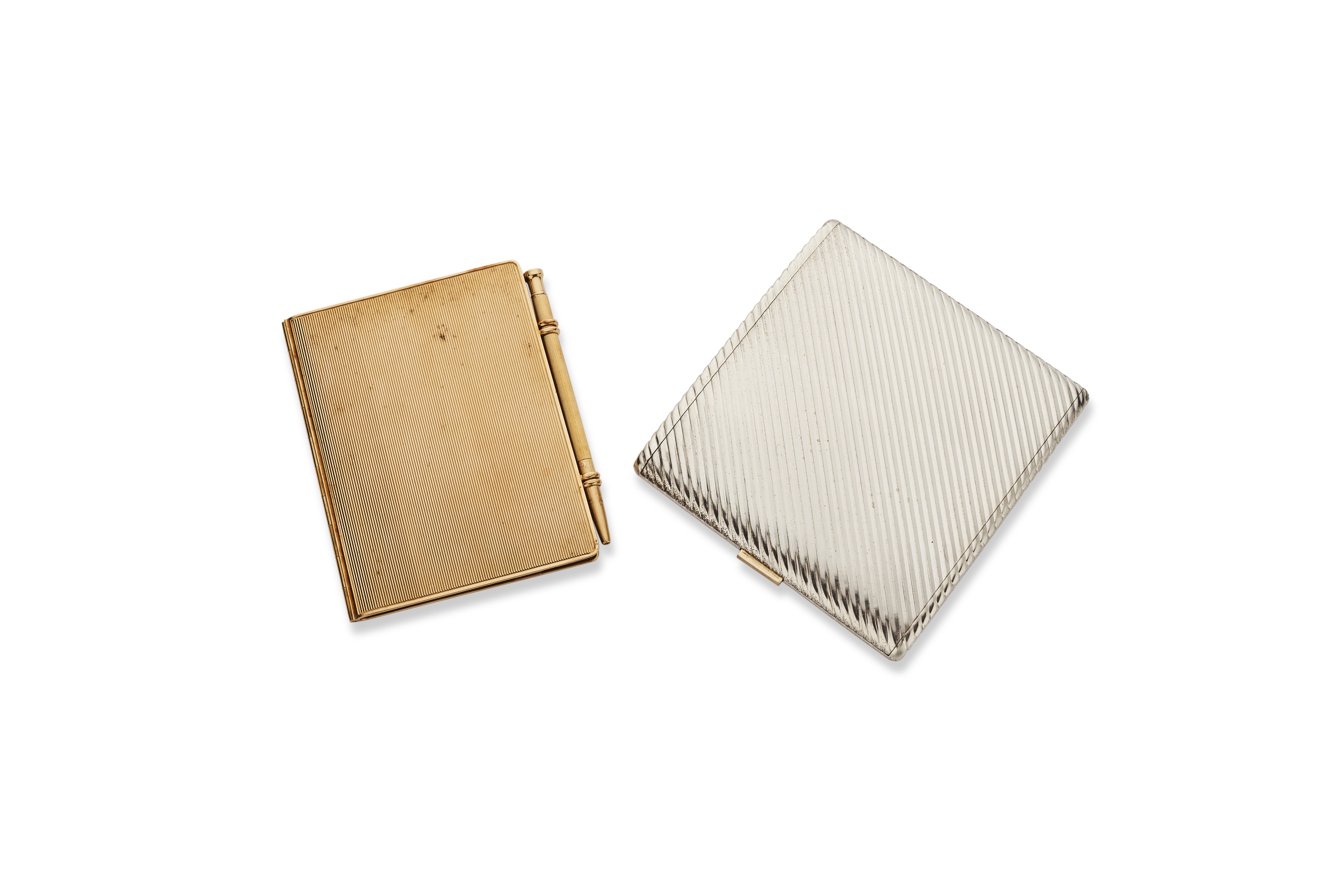 A GOLD NOTEBOOK COVER AND SILVER POWDER COMPACT, BY CARTIER, 20TH ...