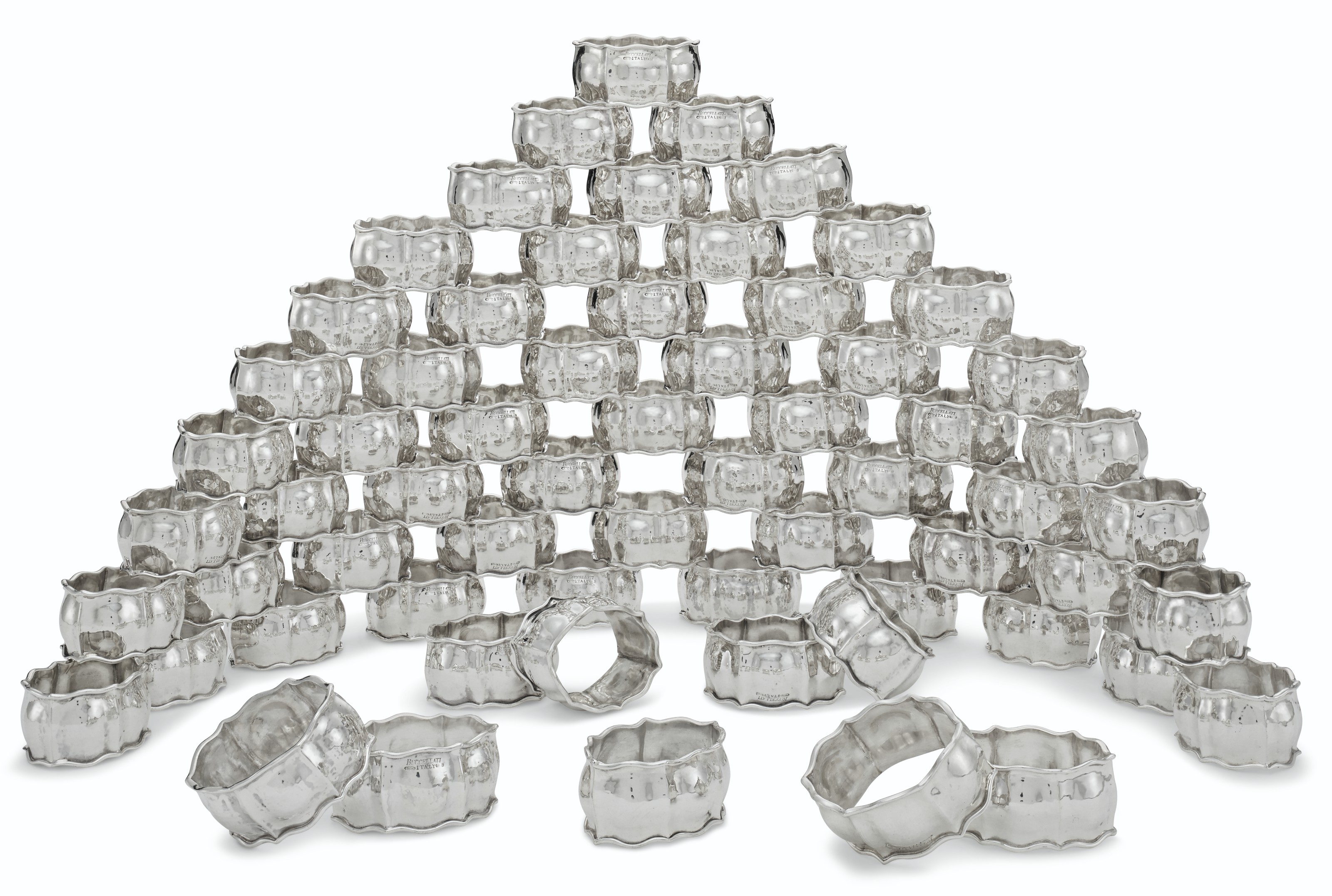 AN EXTENSIVE SET OF SIXTY-FOUR ITALIAN SILVER NAPKIN RINGS, MARK OF ...