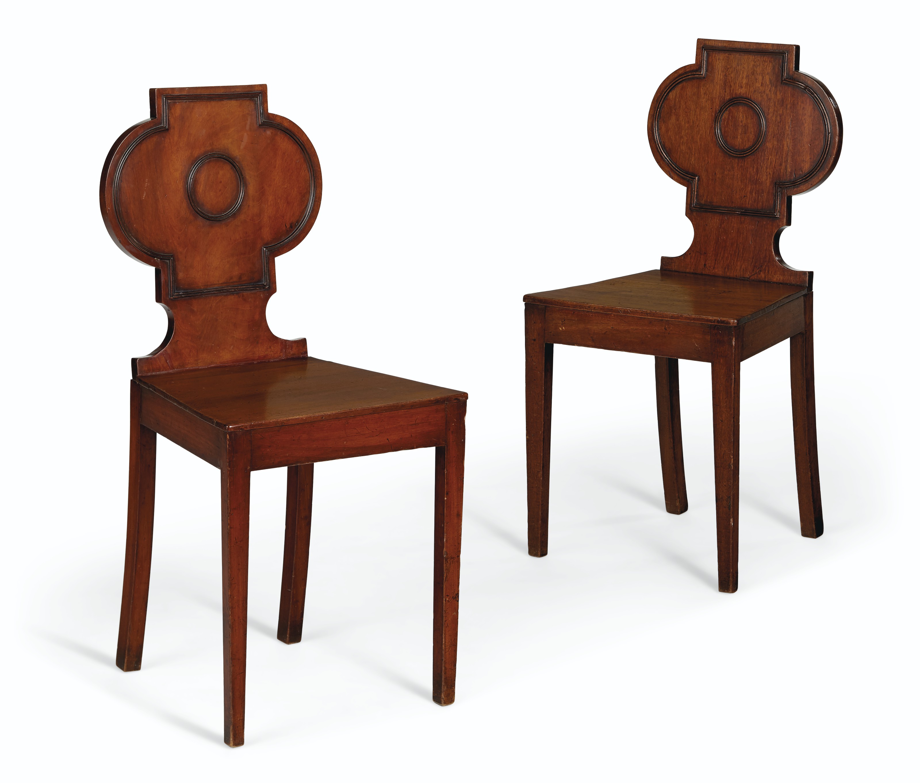 A MATCHED PAIR OF REGENCY MAHOGANY HALL CHAIRS, CIRCA 1825 | Christie’s