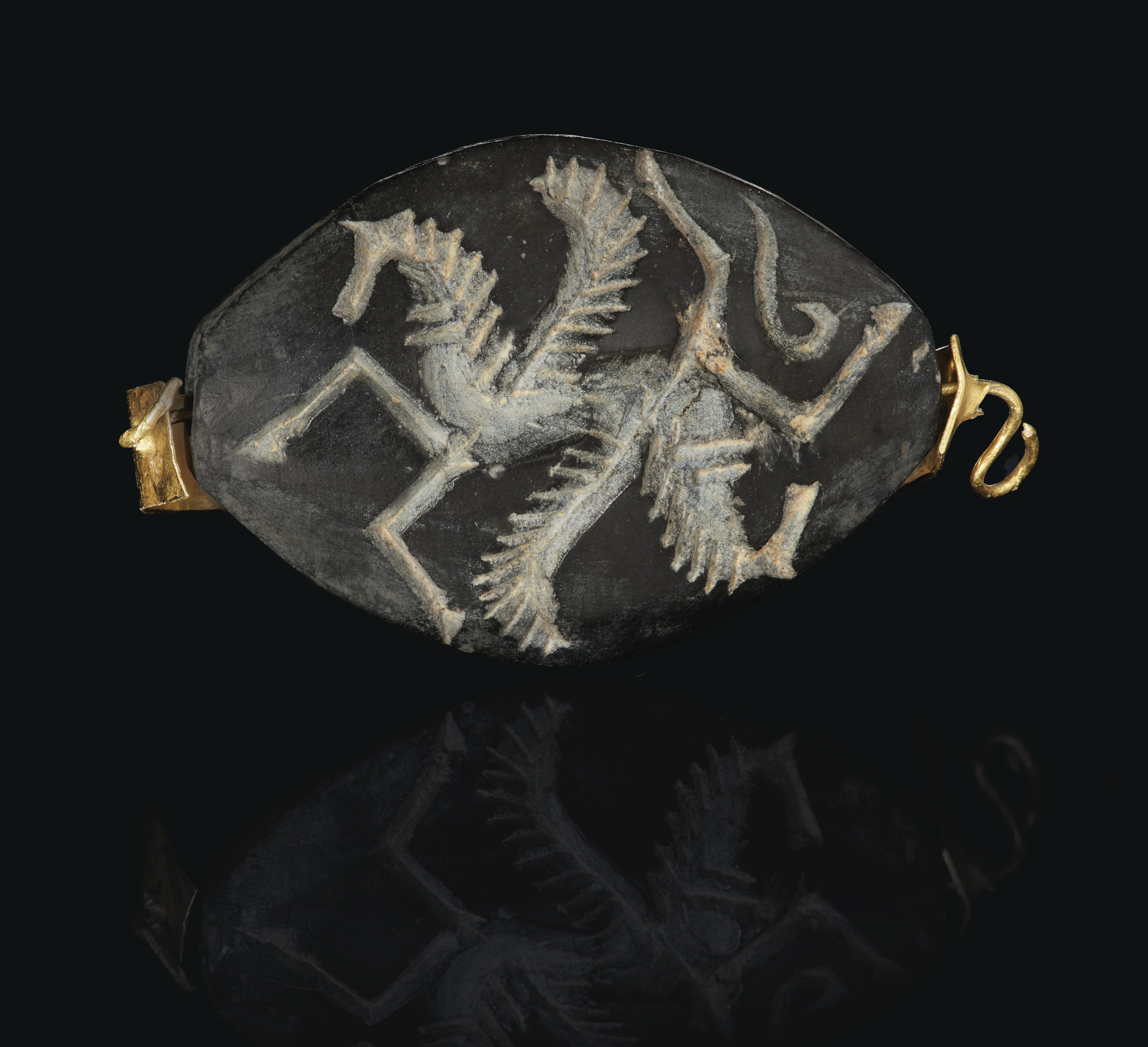 A GREEK GOLD AND BLACK STEATITE AMYGDALOID "ISLAND GEM" FINGER RING ...