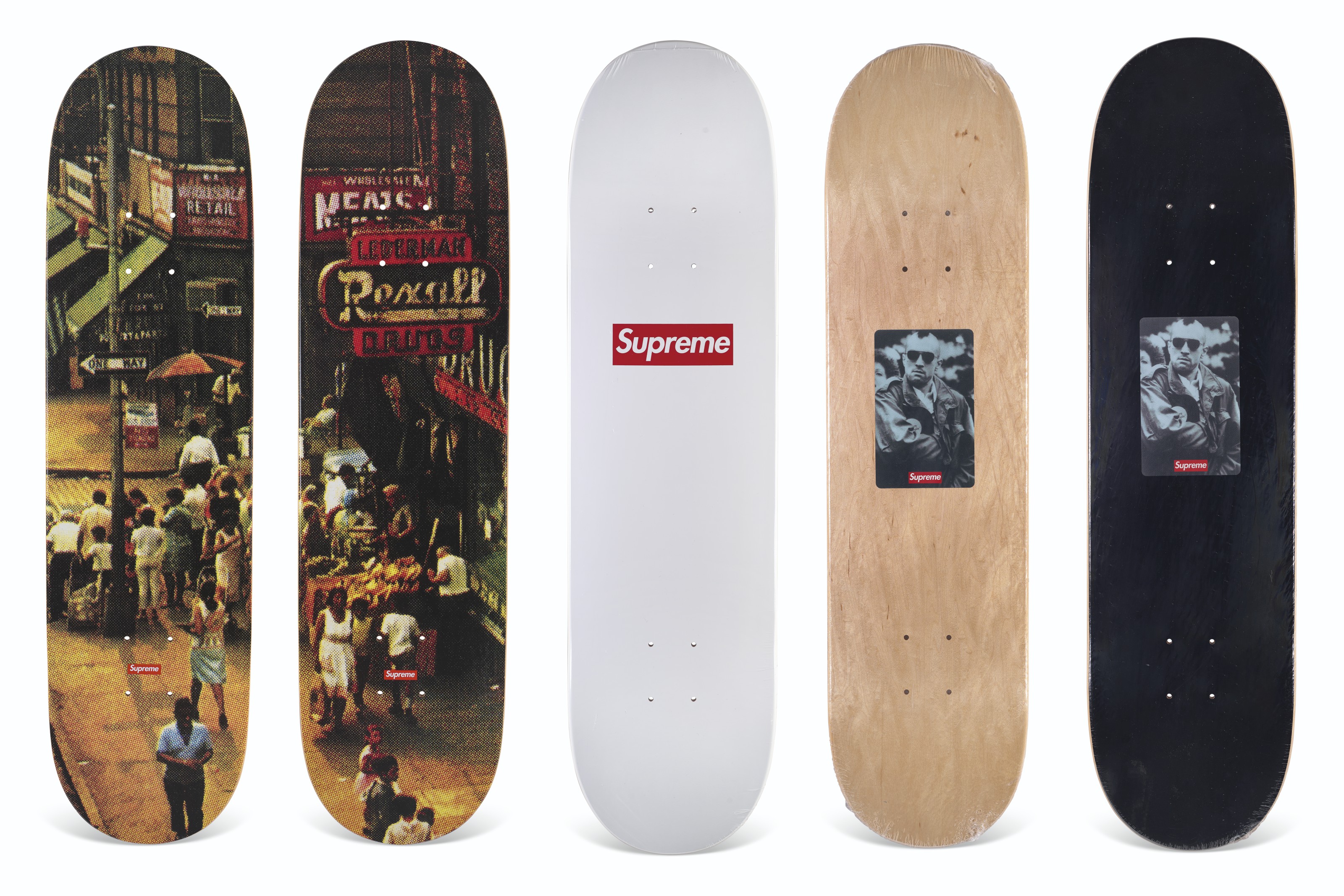 A COLLECTION OF STREET SCENE & 20TH ANNIVERSARY SKATEBOARDS, SUPREME ...