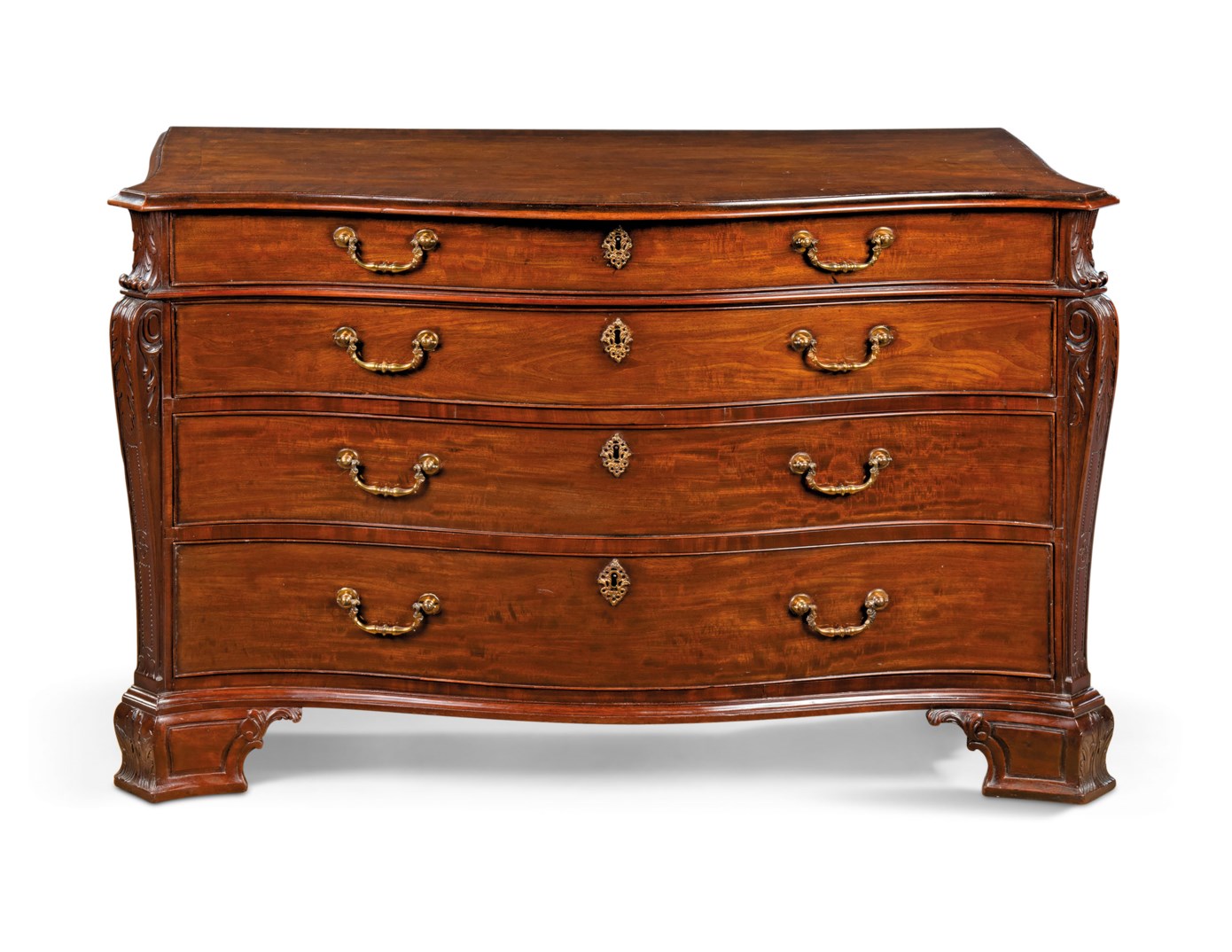 A GEORGE III MAHOGANY SERPENTINE COMMODE, ATTRIBUTED TO WILLIAM GOMM ...