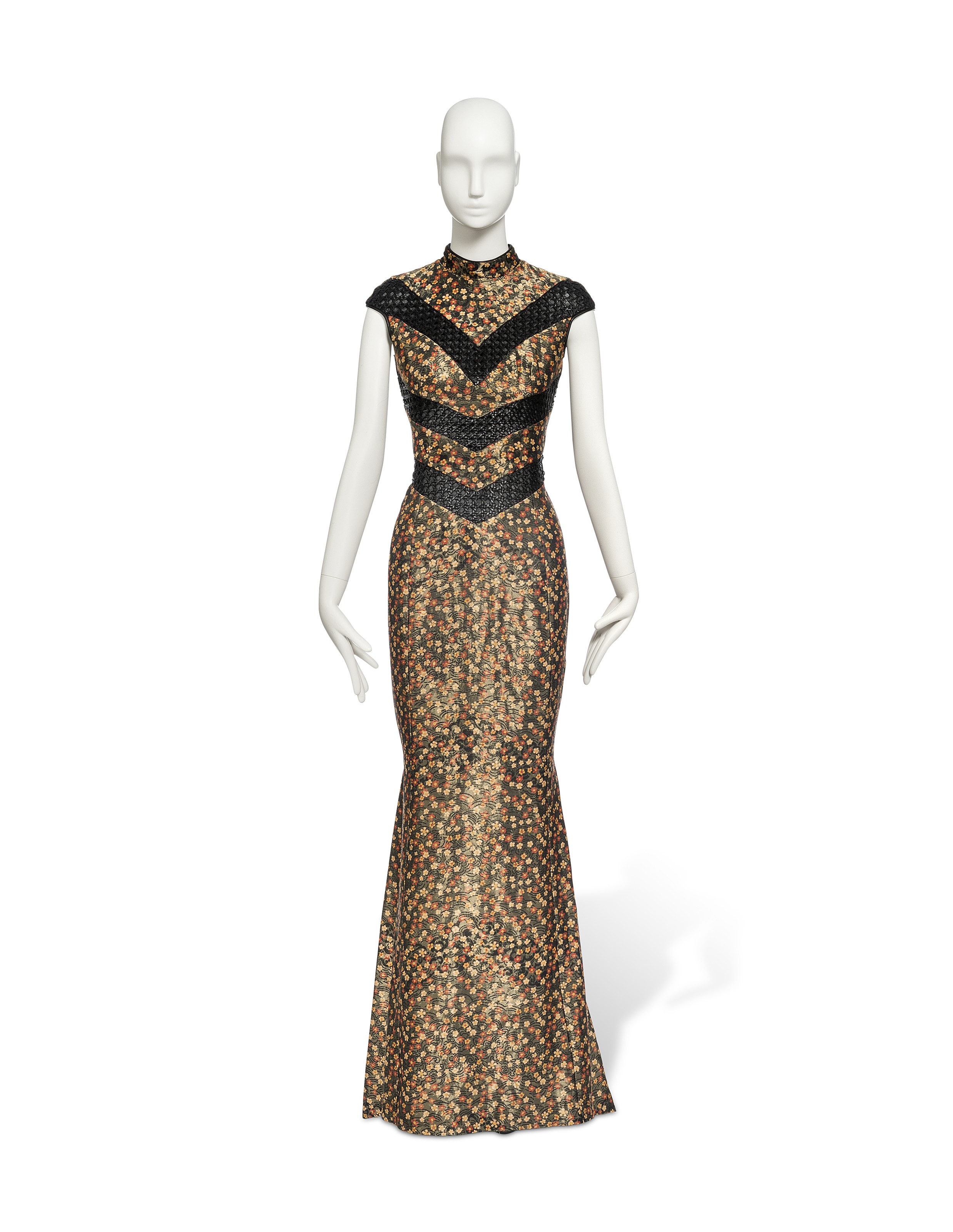 A GOLD LAMÉ AND LEATHER EVENING GOWN WORN BY MICHELLE DOCKERY A GOLD ...