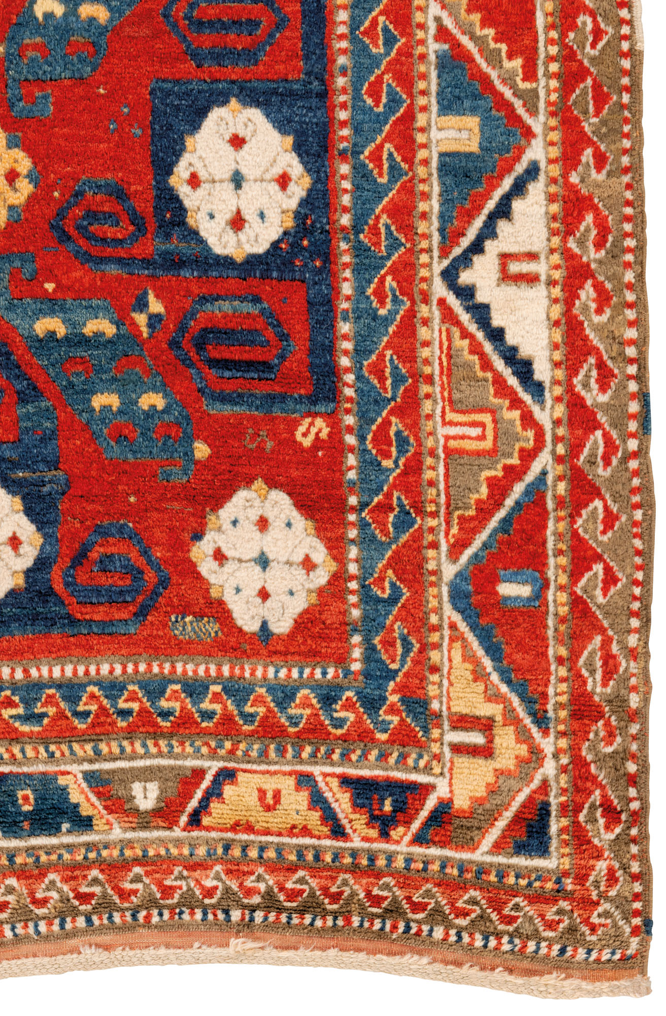 A 'PINWHEEL' KAZAK RUG