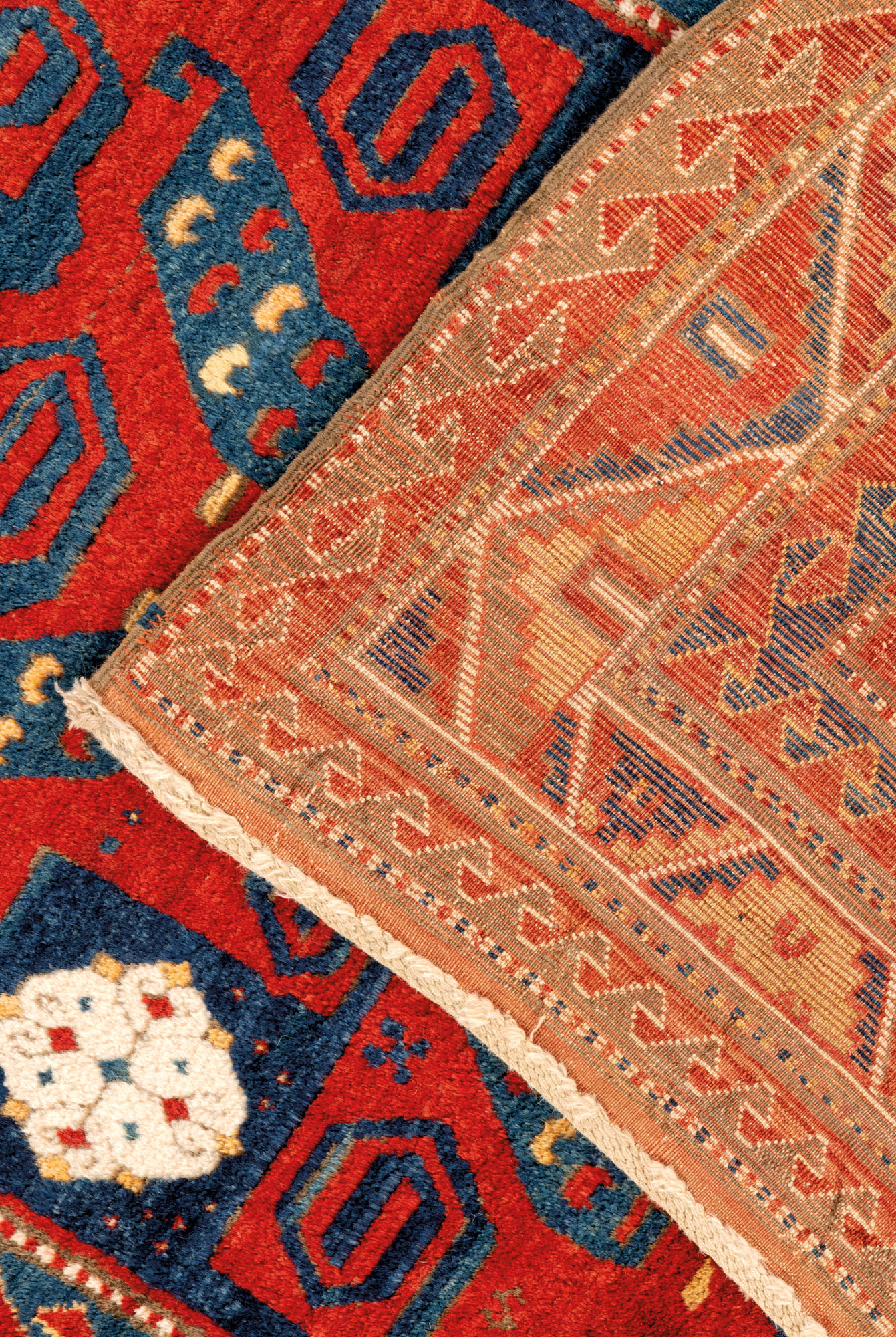 A 'PINWHEEL' KAZAK RUG