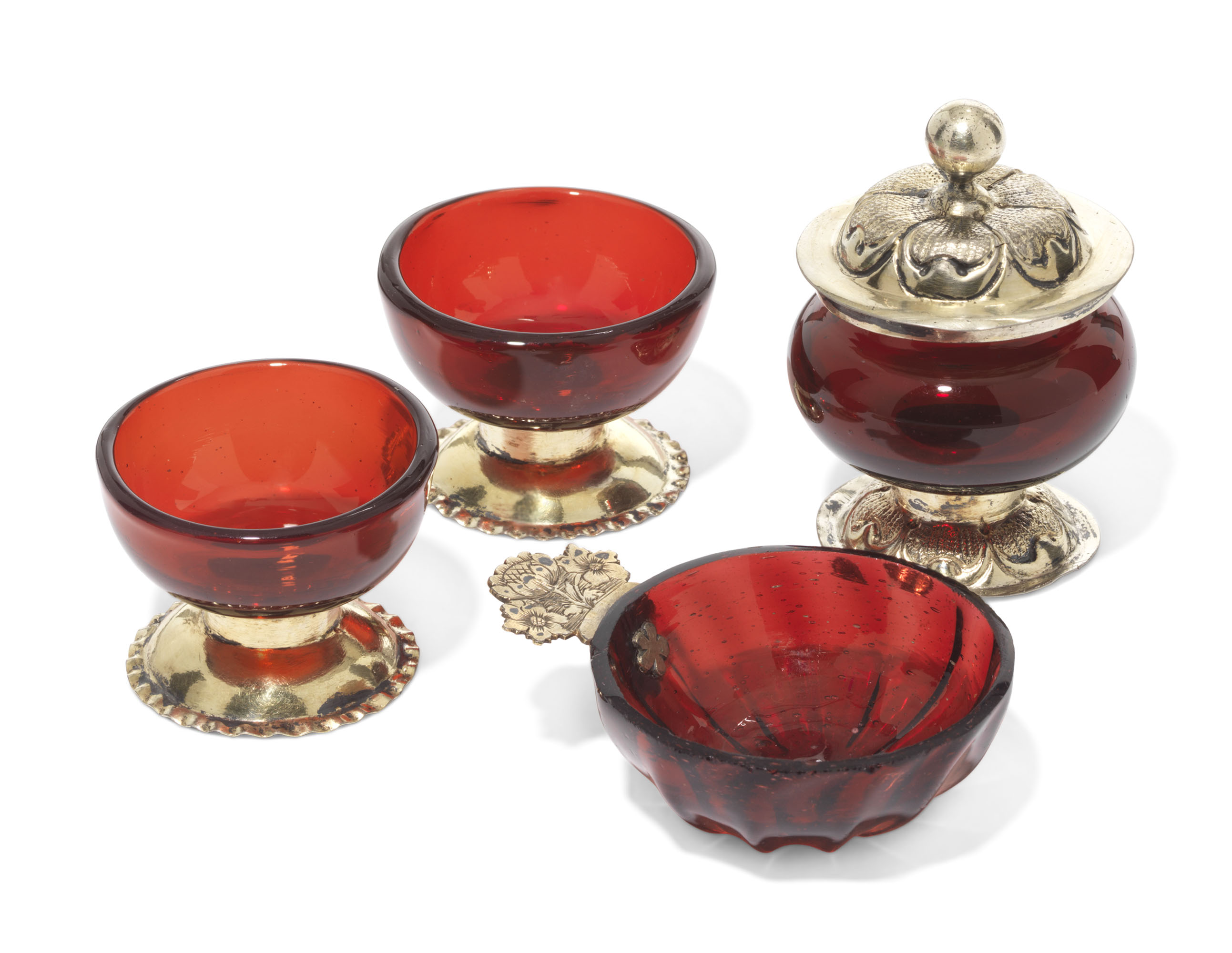 A GROUP OF GERMAN SILVER-GILT AND GILT-METAL MOUNTED RUBY-GLASS ...