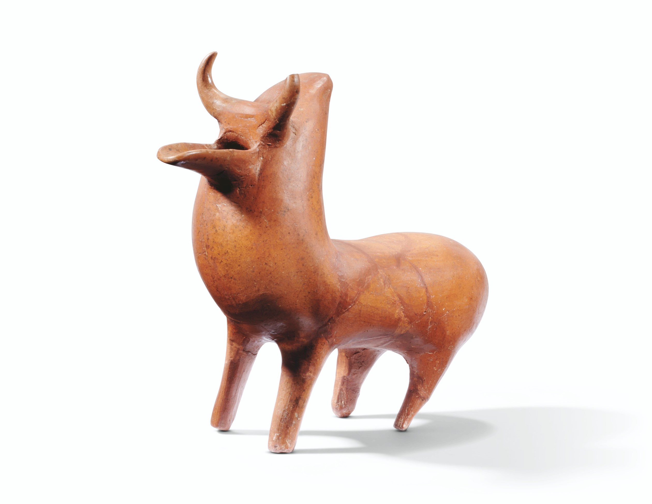 AN AMLASH POTTERY BULL RHYTON, IRAN, CIRCA EARLY 1ST MILLENNIUM B.C ...