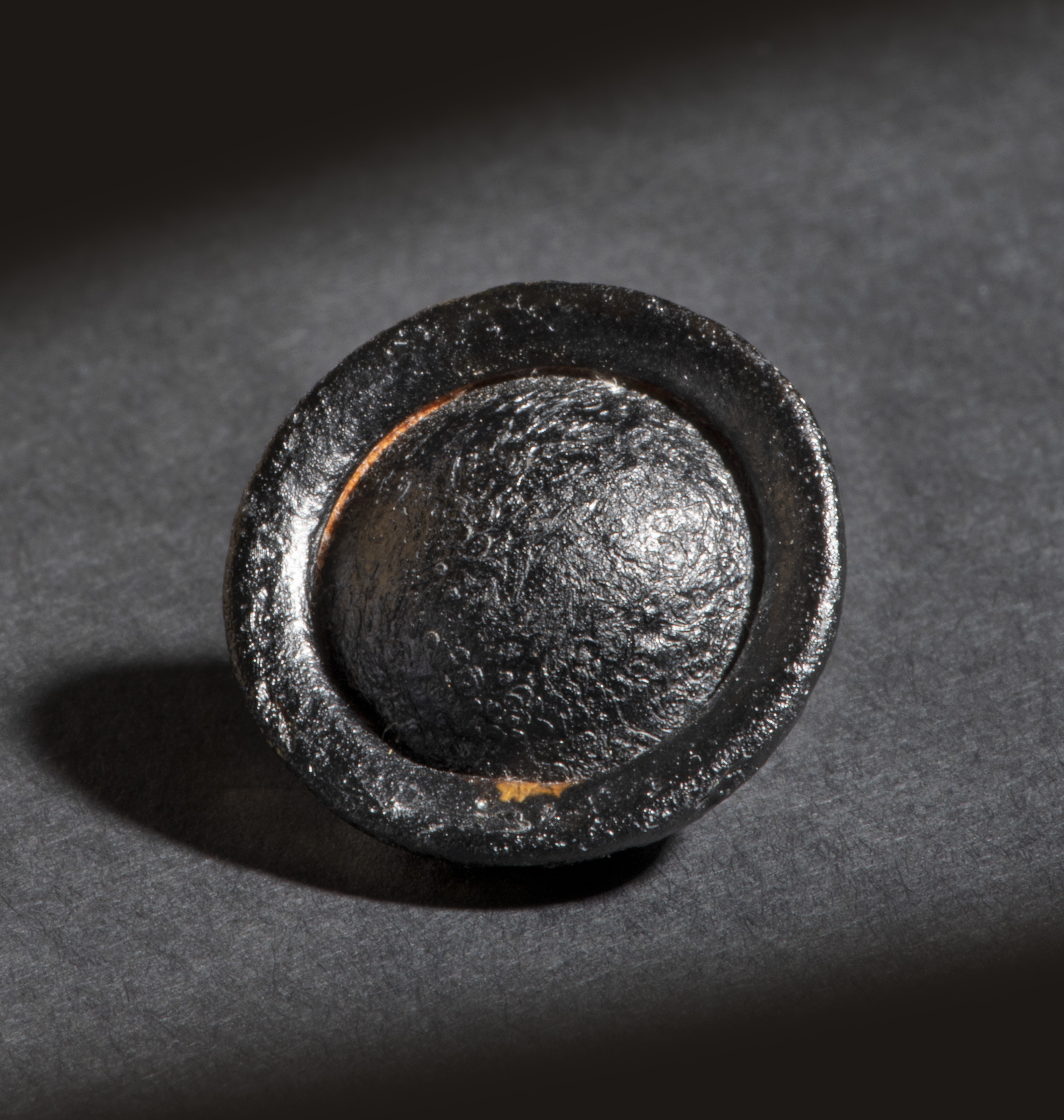 A "BUTTON" TEKTITE, IMPACT GLASS AUSTRALIA | Christie’s