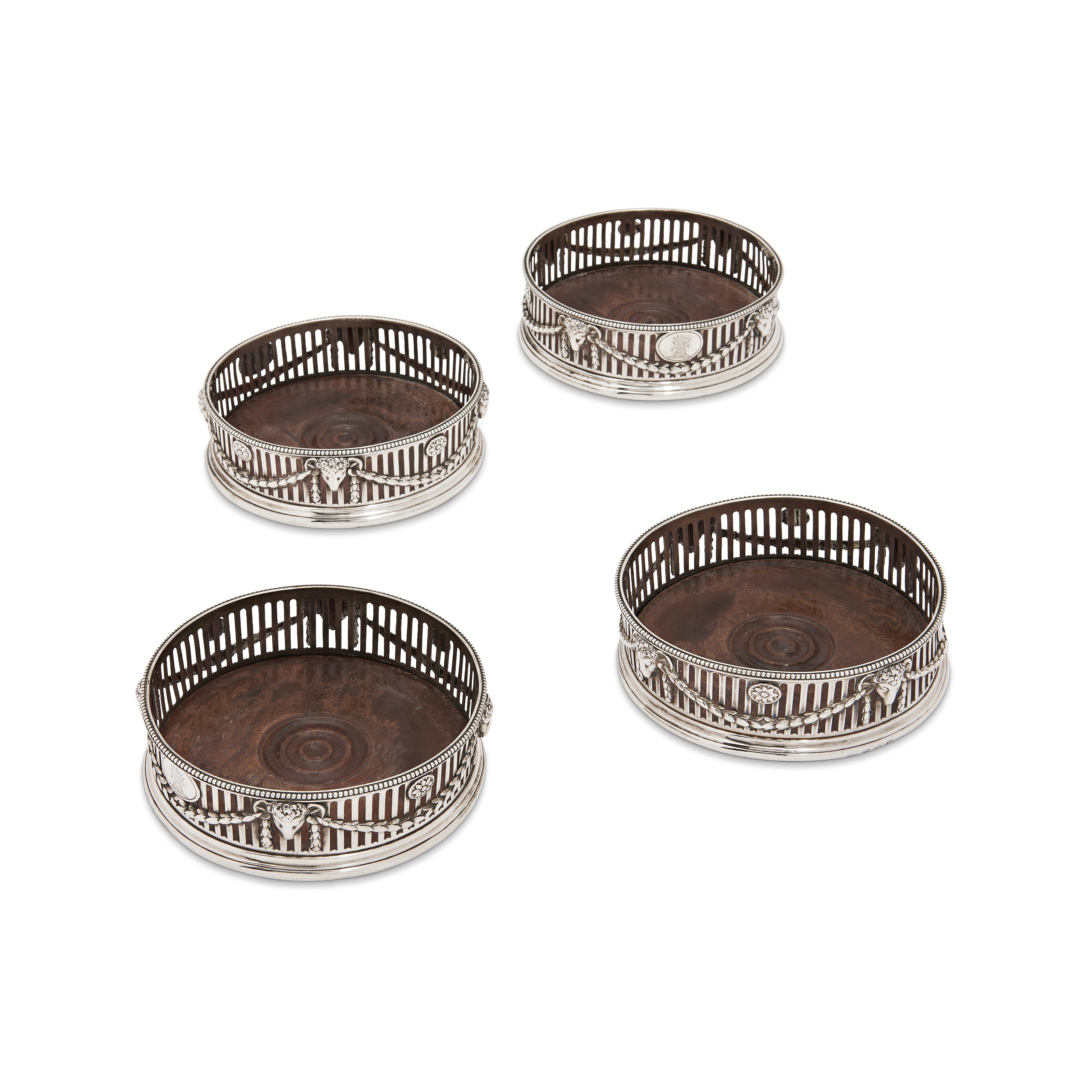 A SET OF FOUR GEORGE III SILVER WINE-COASTERS, MARK OF ROBERT HENNELL ...