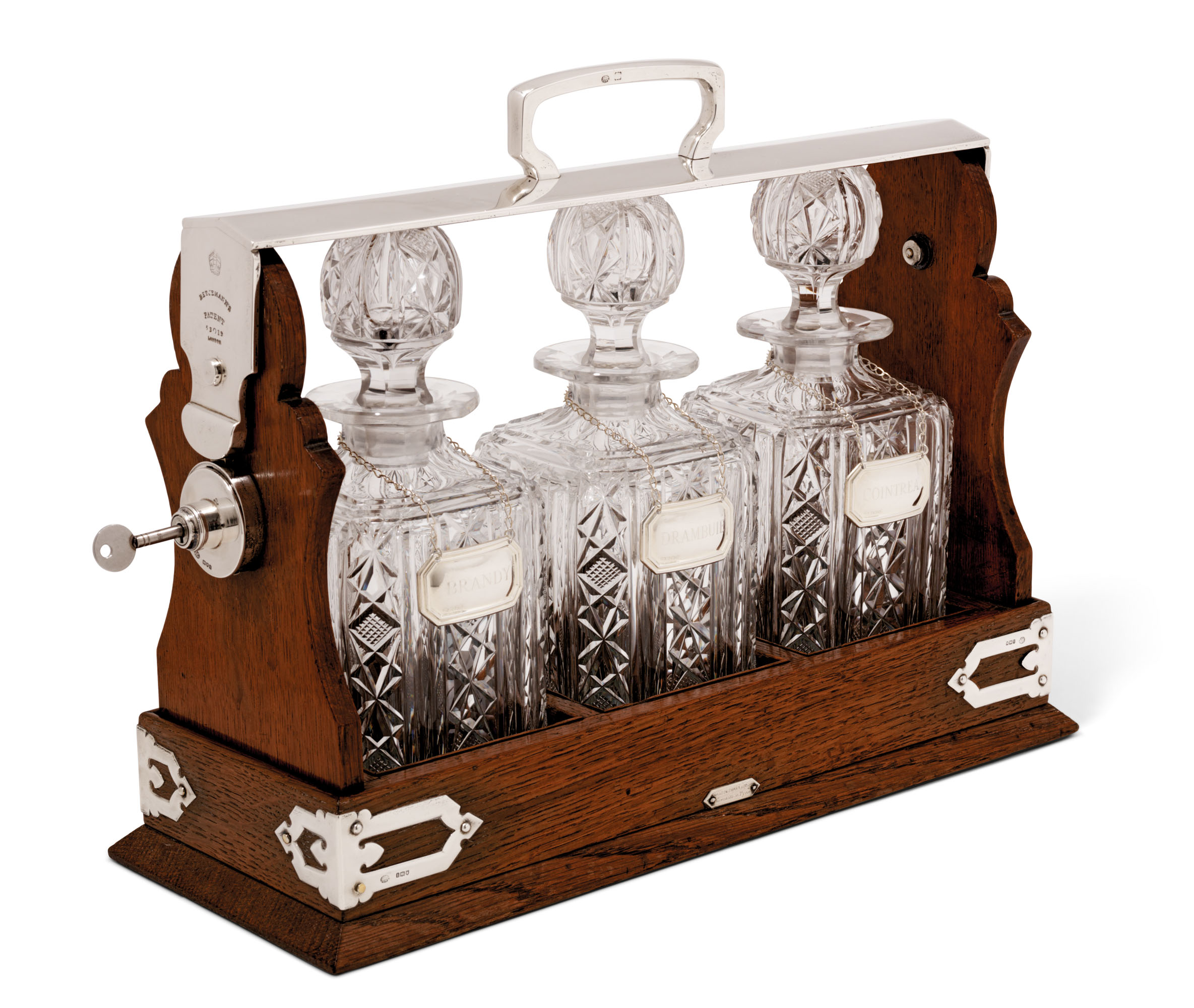 AN EDWARD VII SILVER-MOUNTED OAK TANTALUS