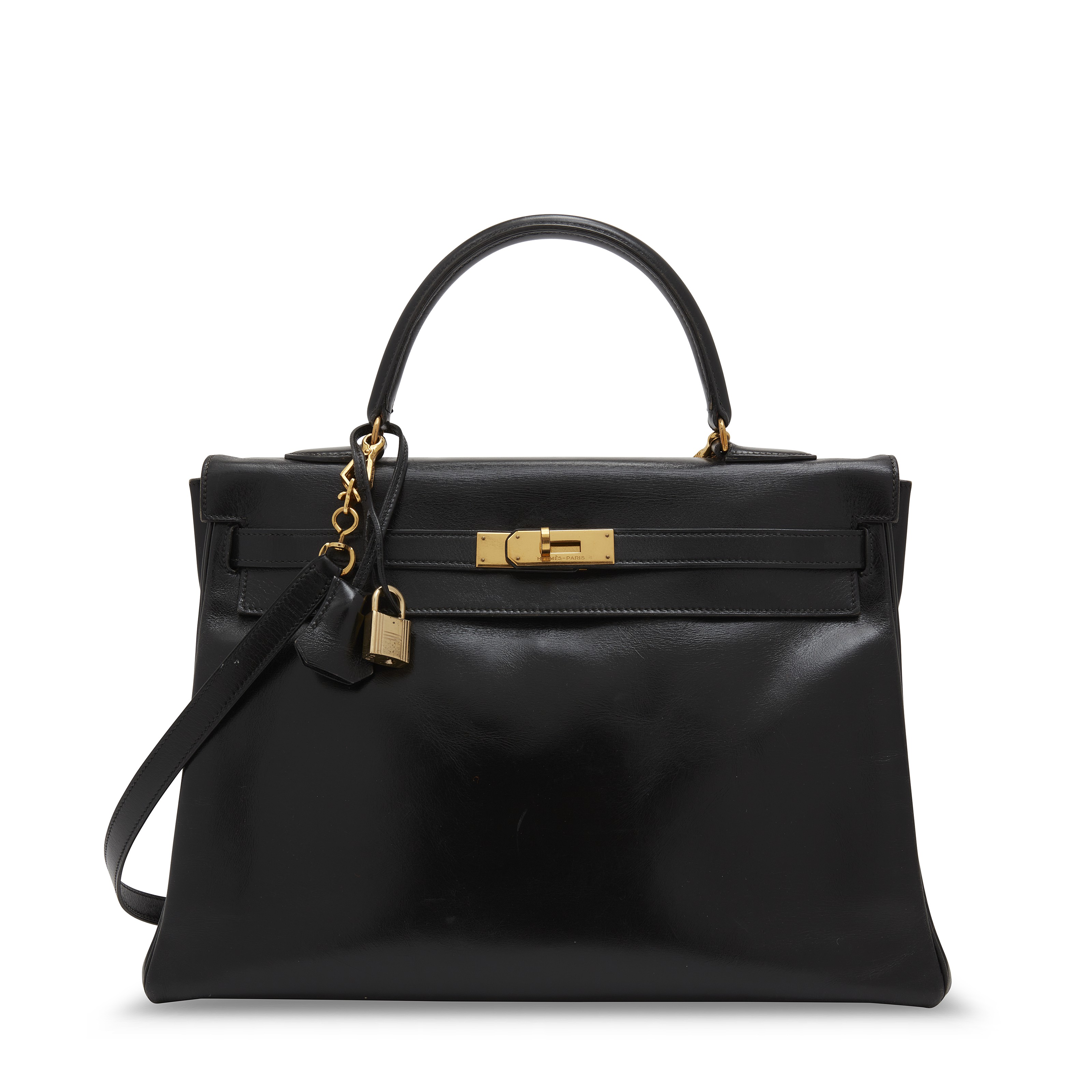 A BLACK CALF BOX LEATHER RETOURNÉ KELLY 35 WITH GOLD HARDWARE, HERMÈS ...