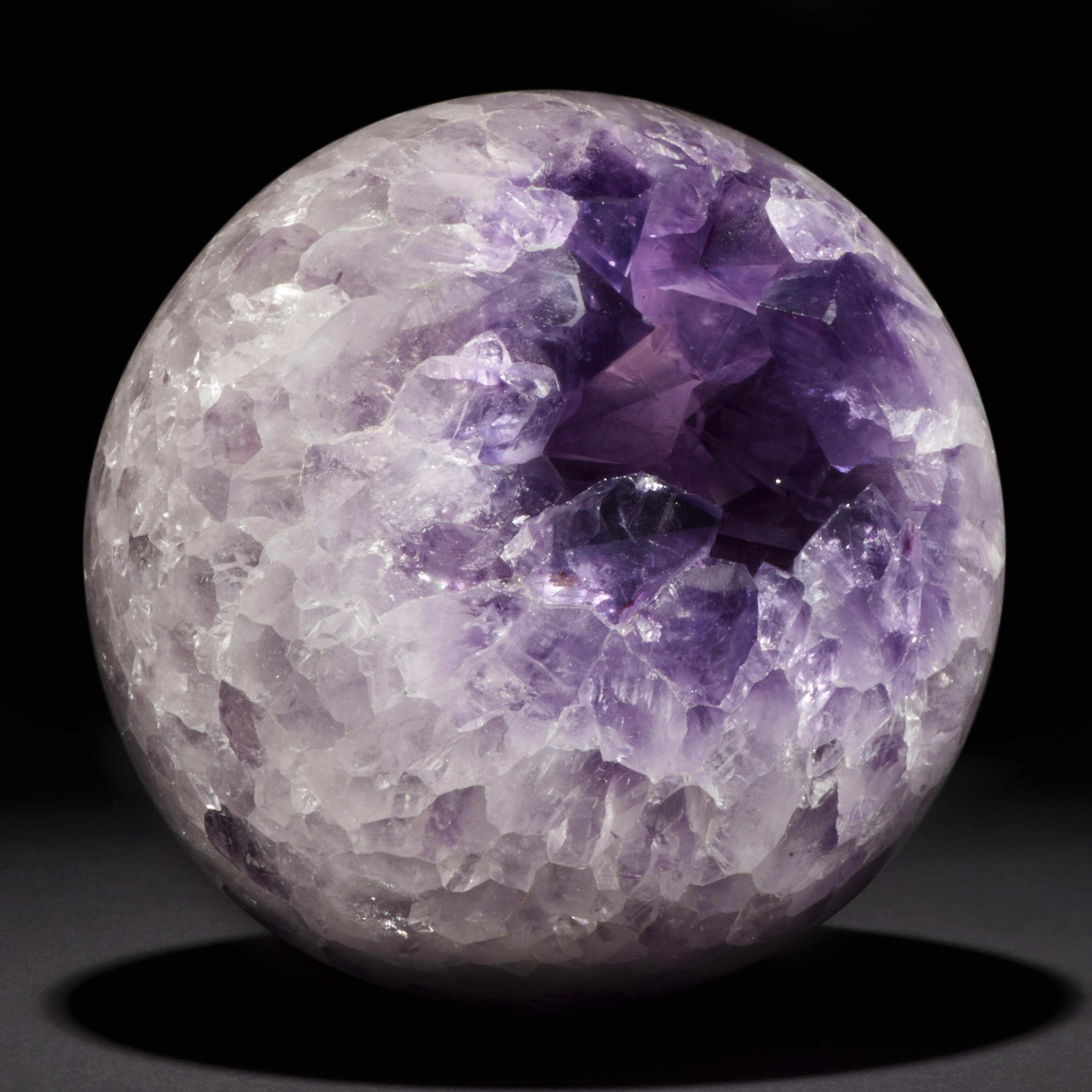 A FINE AMETHYST SPHERE WITH CRYSTAL CAVITY, BRAZIL | Christie’s