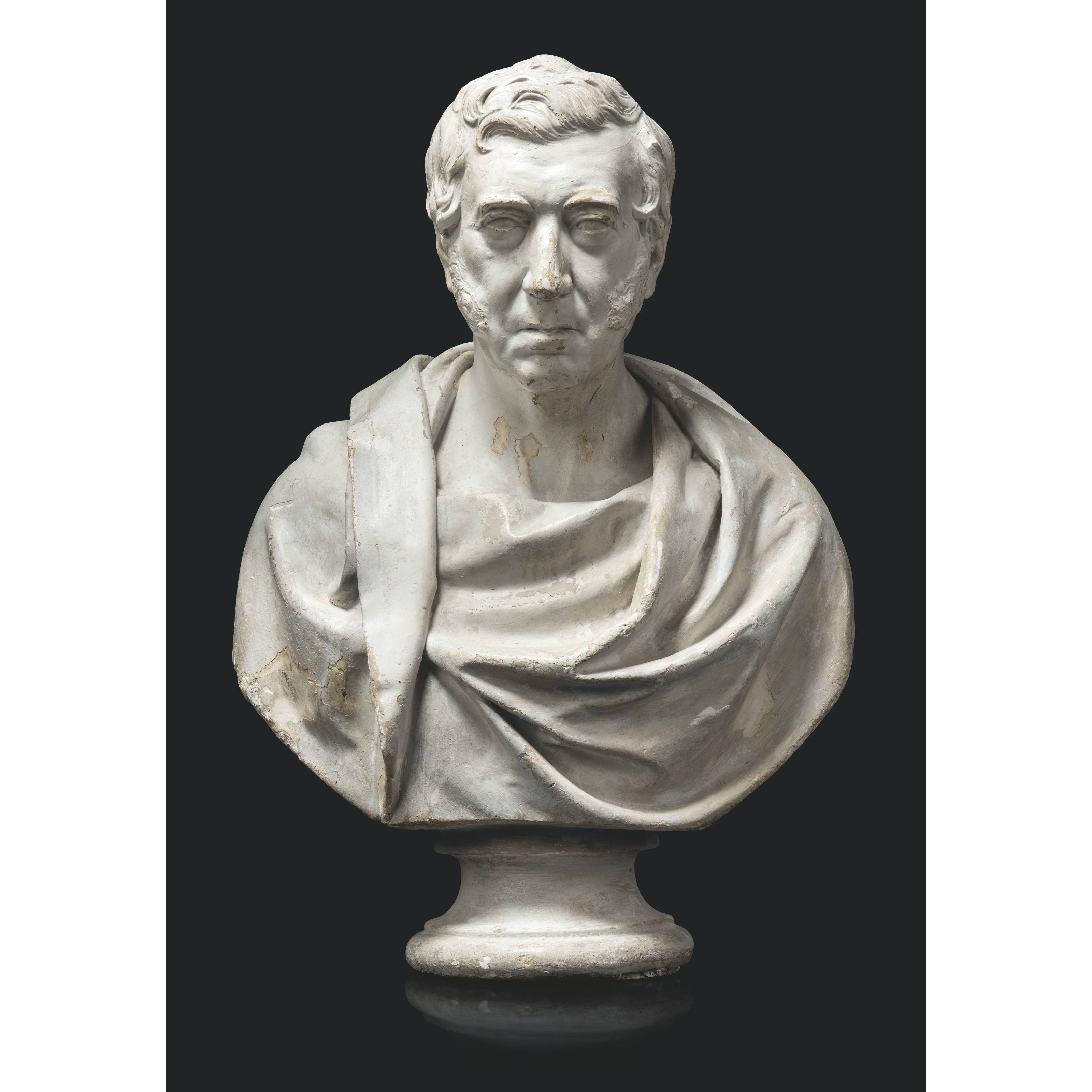 AN EARLY VICTORIAN GREY PAINTED PLASTER BUST OF A GENTLEMAN, CIRCA 1840 ...