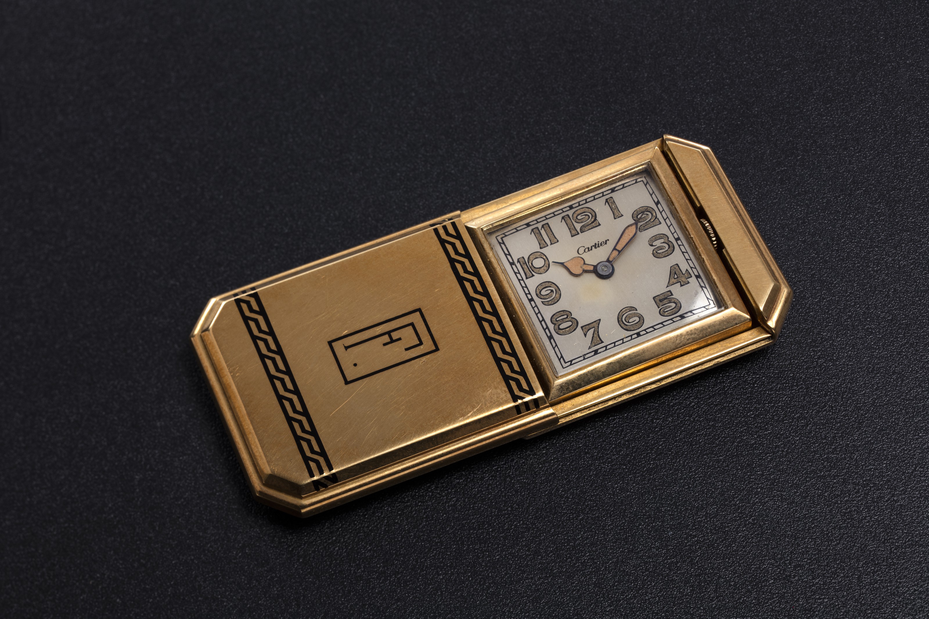 CARTIER, A GOLD SLIDING ART DECO PURSE WATCH WITH IWC MOVEMENT, CASE ...