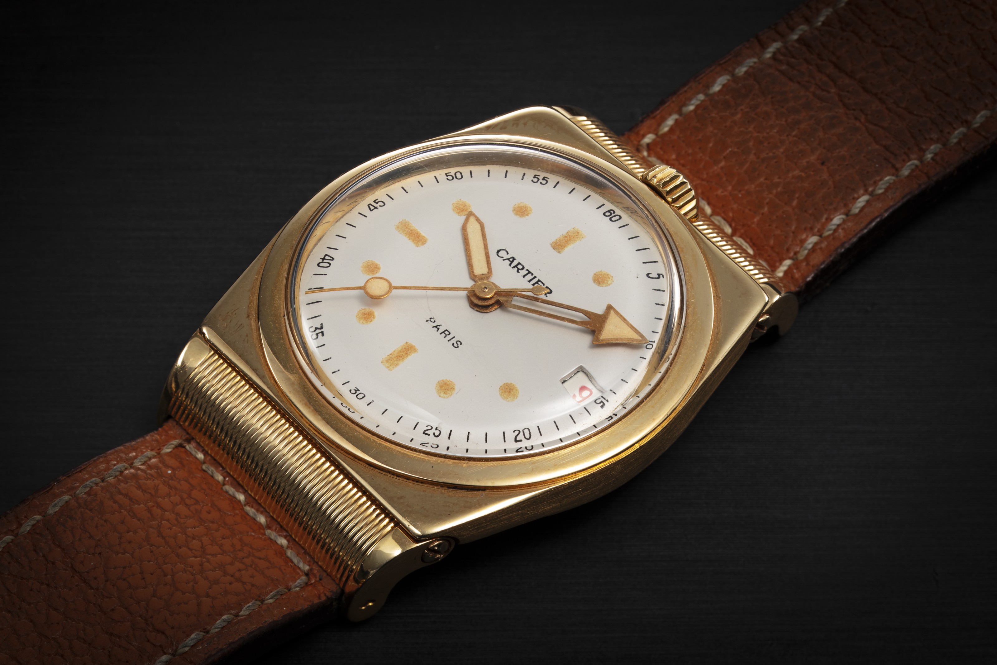 CARTIER, A RARE 18K GOLD TONNEAU-SHAPED AUTOMATIC WRISTWATCH WITH ...