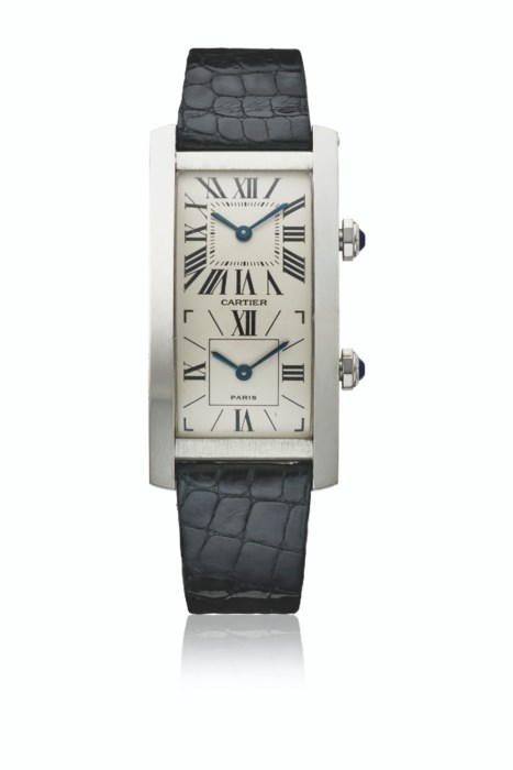 CARTIER. A RARE AND UNUSUAL PLATINUM DUAL TIME RECTANGULAR CURVED ...